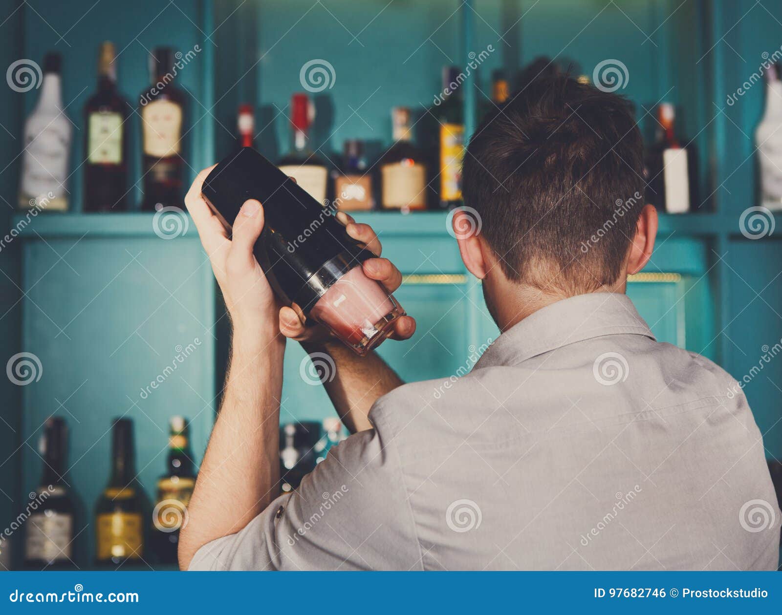 Bartender Mixing Alcoholic Cocktail in Shaker Stock Photo - Image of ...