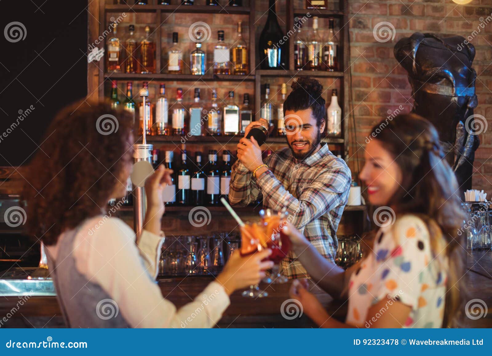 Bartender Mixing a Cocktail Drink in Cocktail Shaker Stock Photo ...