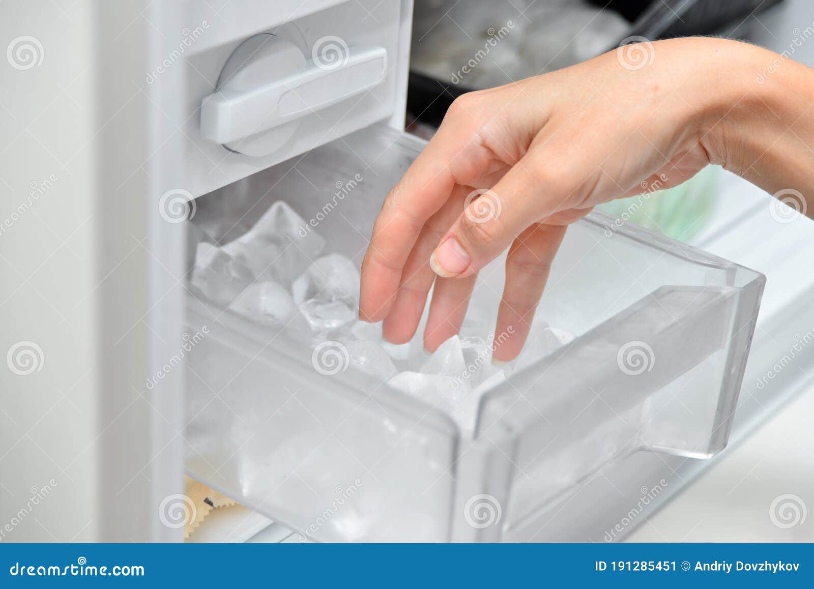 The Bartender Opens the Ice Tray, Taking it Out of the Ice Maker To ...