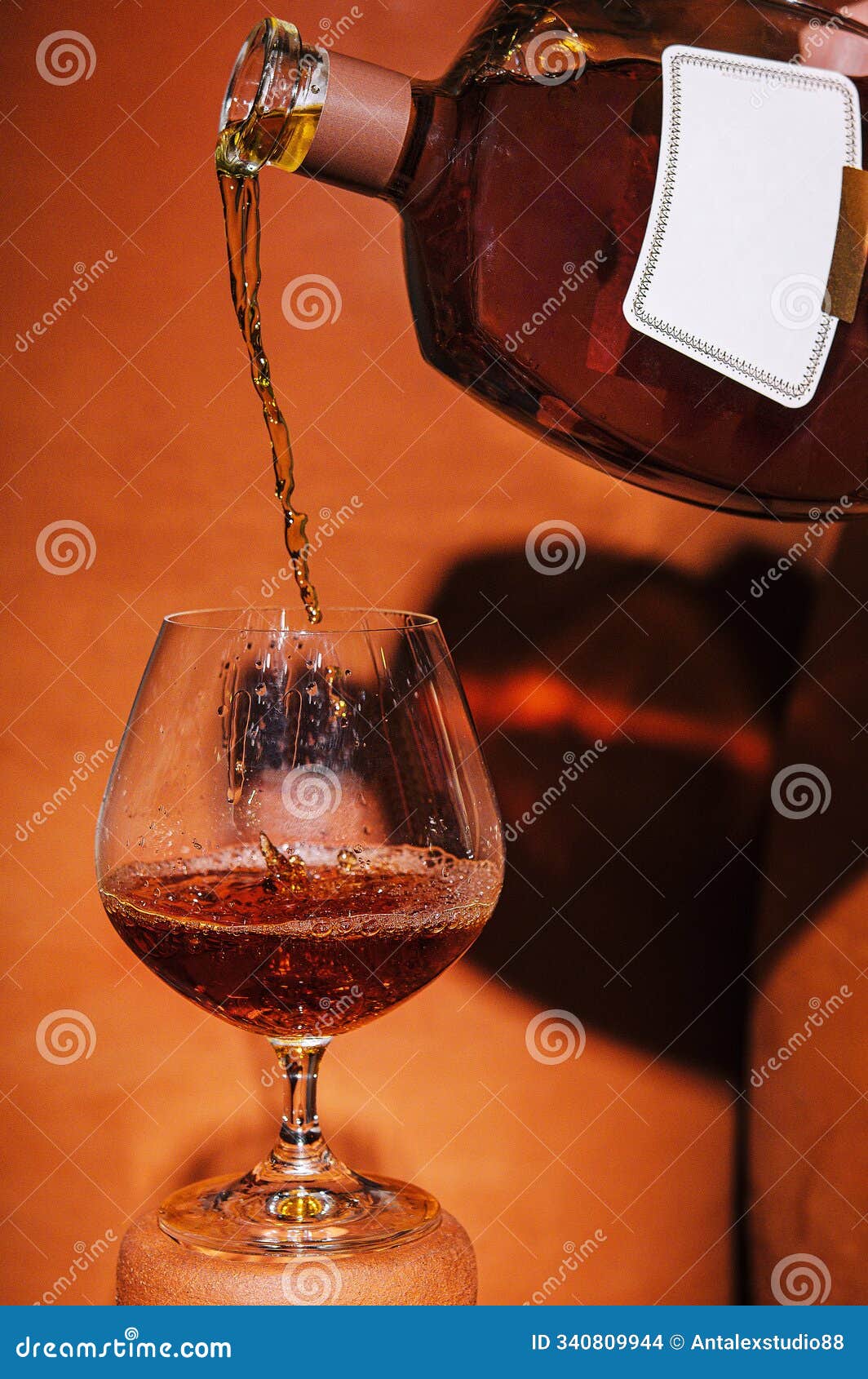 Bartender Pouring Brandy from Bottle with Blank Label into Glass Stock ...