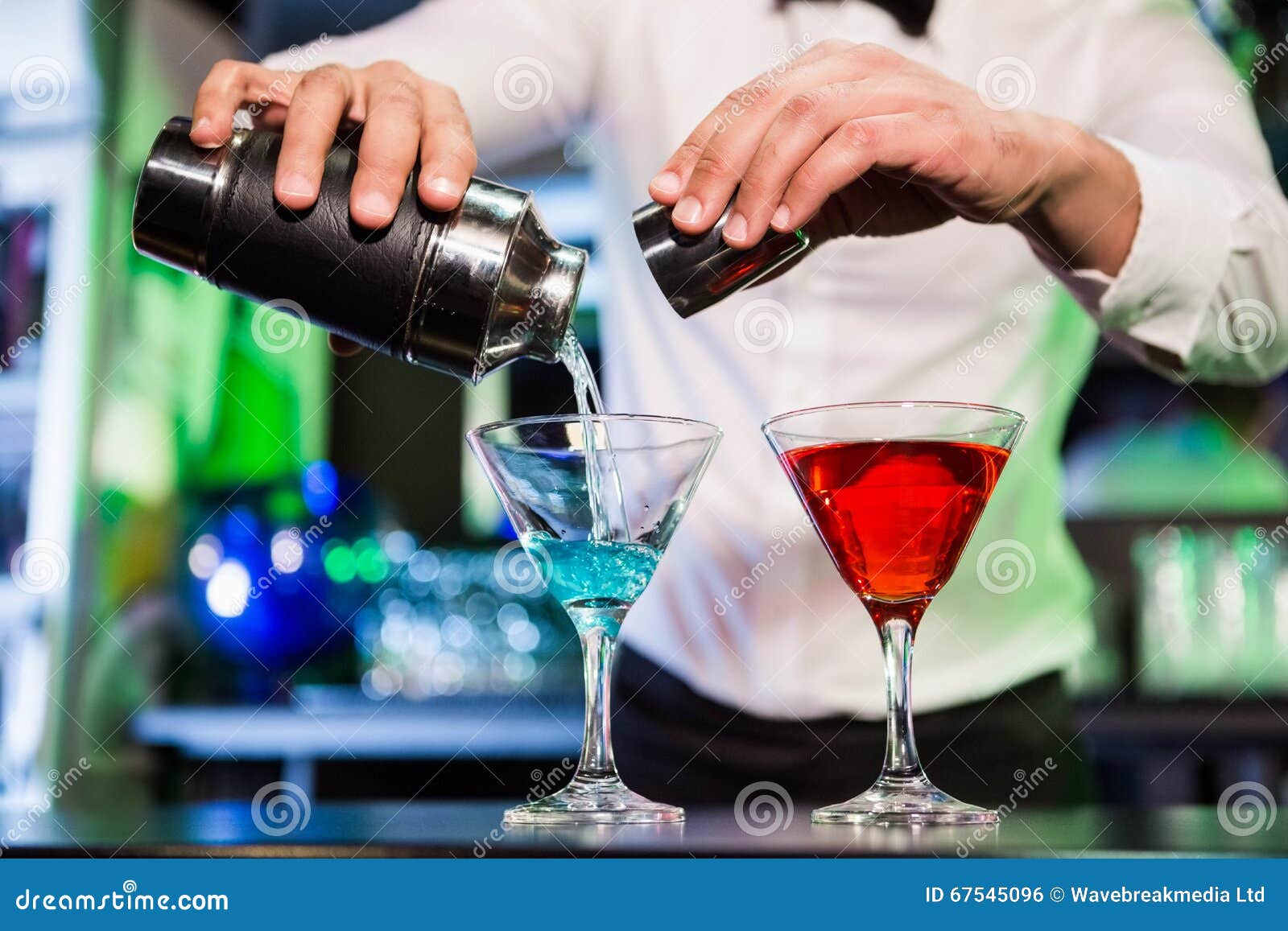 Bartender Pouring Cocktail into Glasses Stock Photo - Image of indoors ...