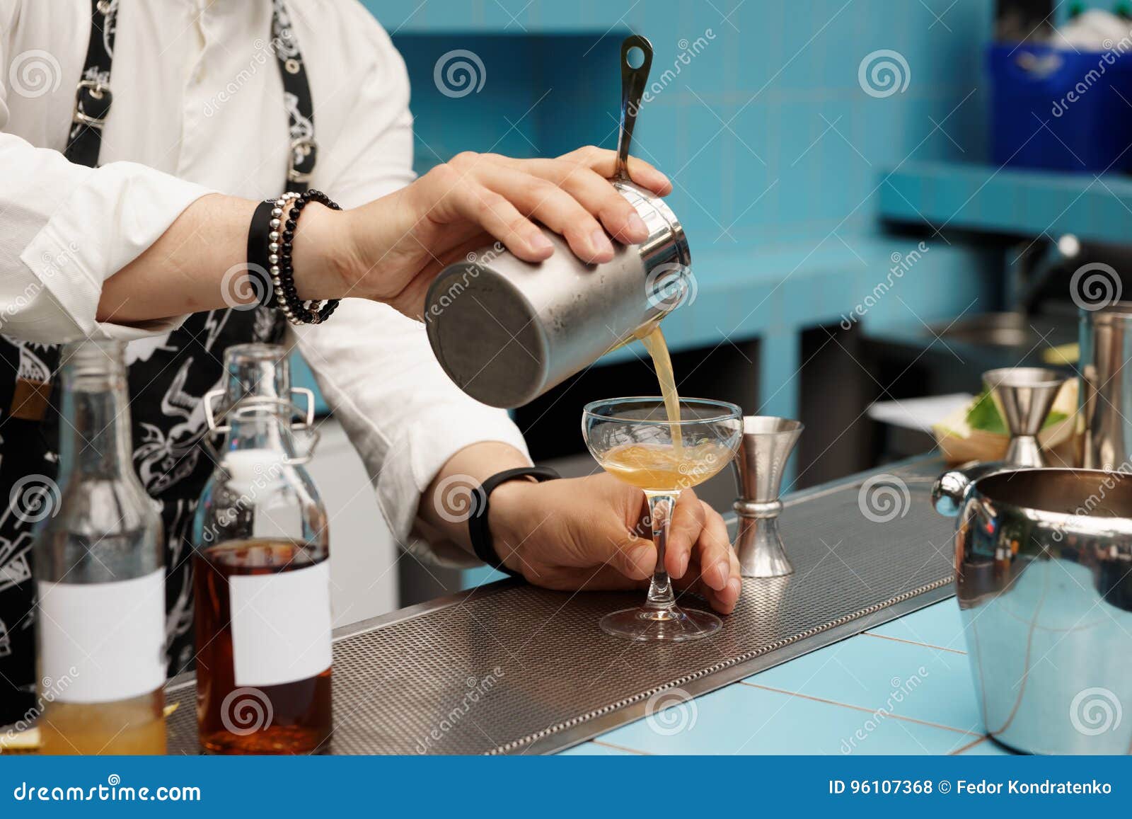 Bartender is Pouring Cocktail from Shaker Stock Photo - Image of club ...