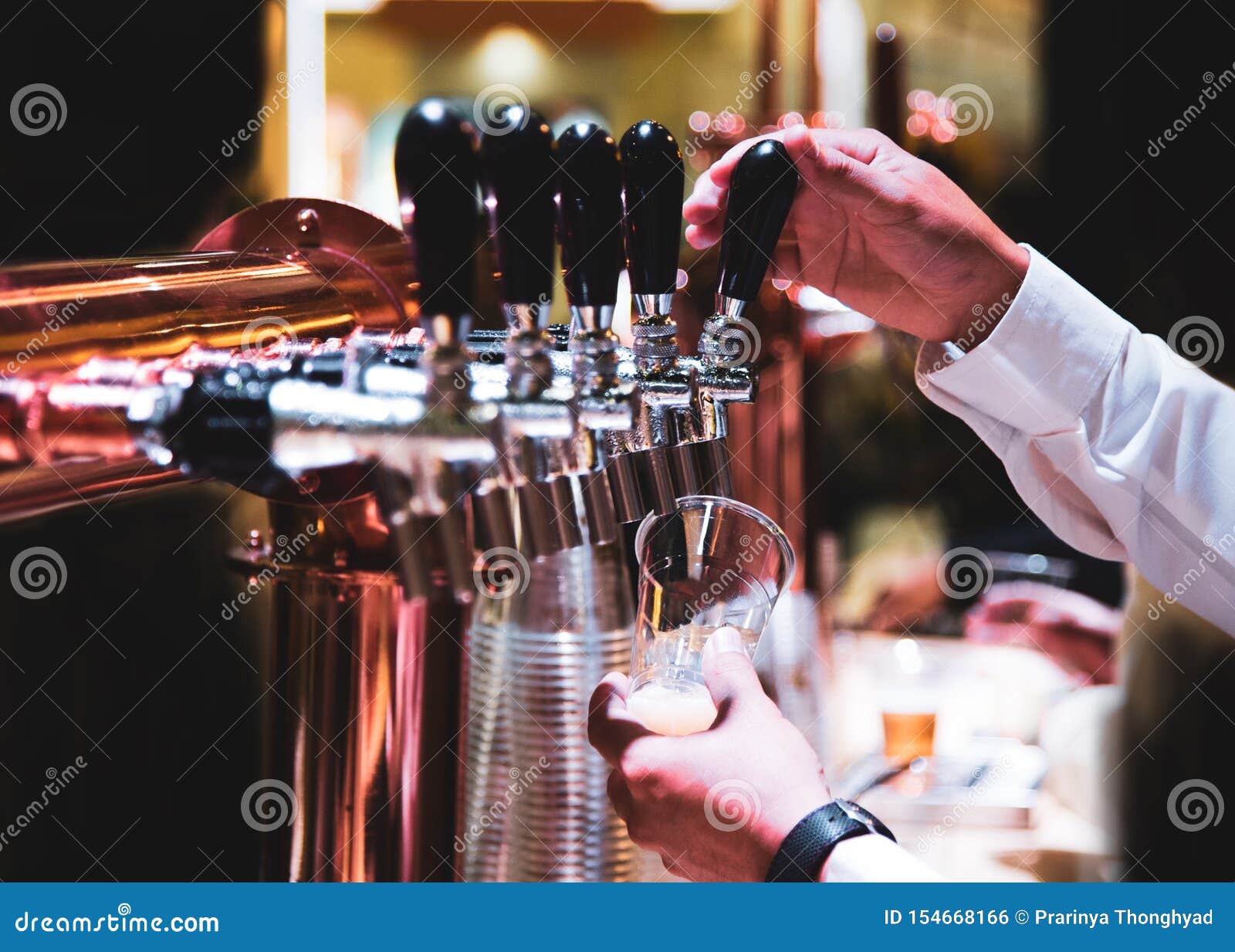 Bartender Pouring Draft Beer in the Bar, Barman Hand at Beer Tap ...