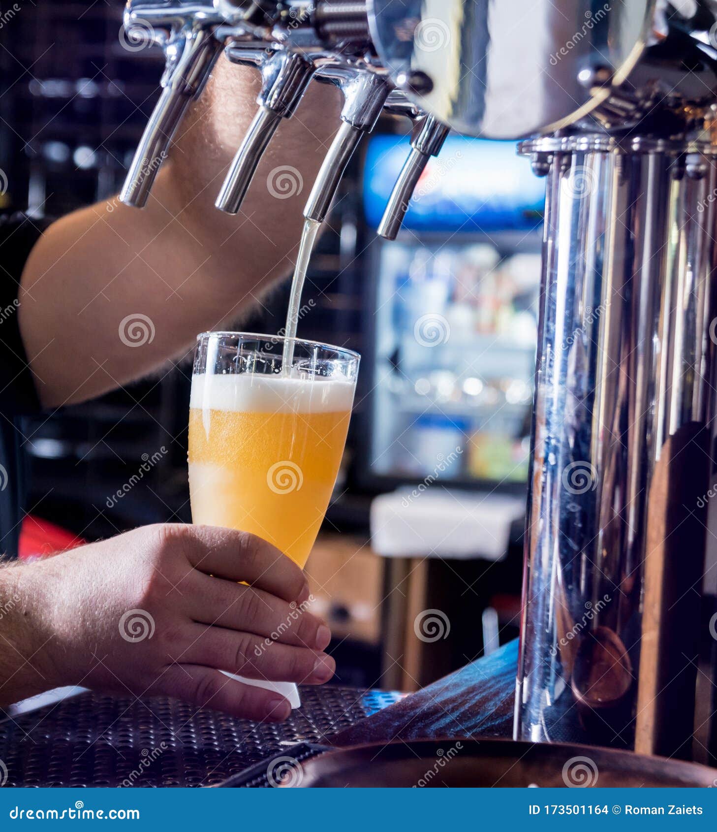 Bartender Pouring Draft Beer at Glasses in the Bar. Restaurant Stock ...