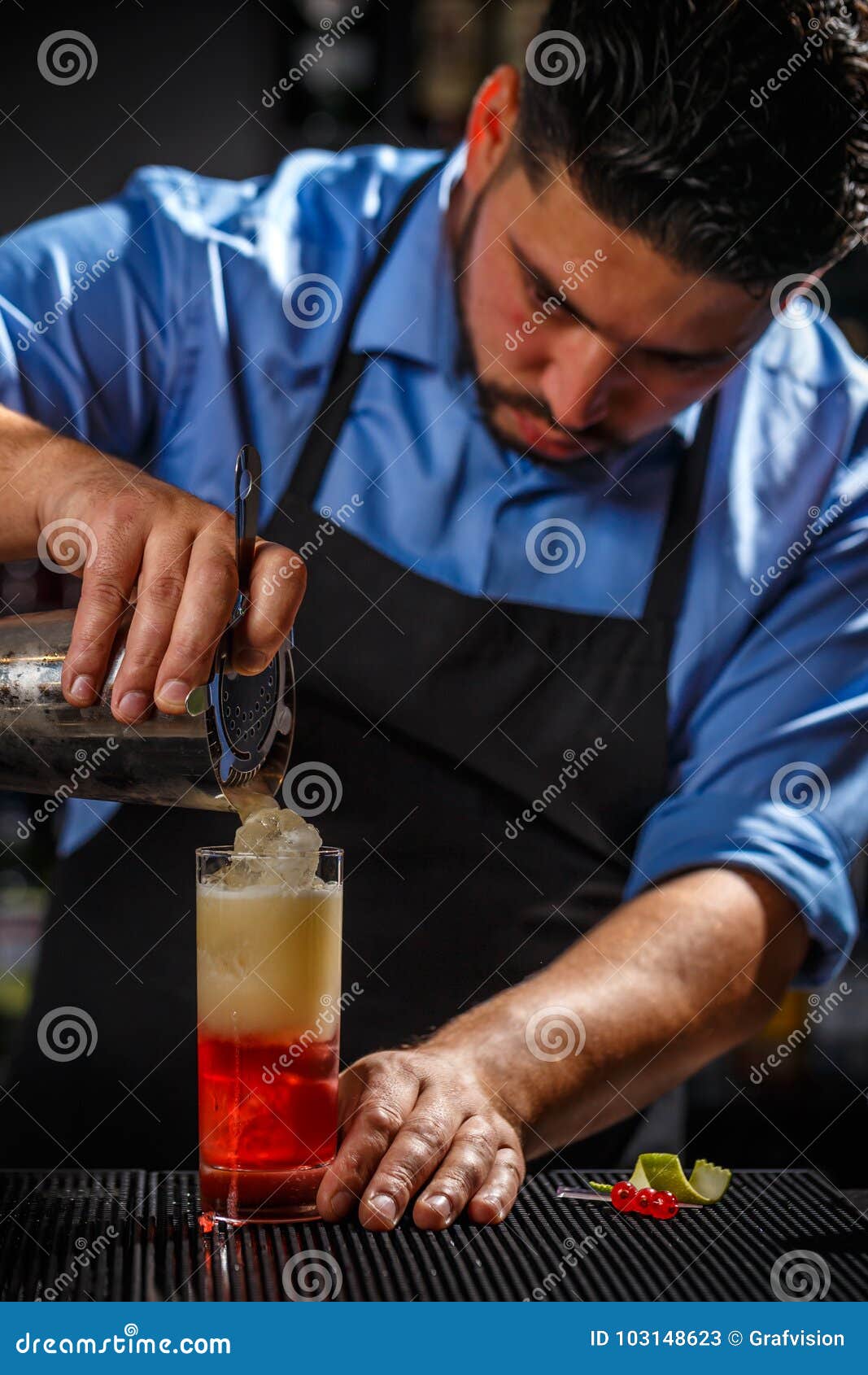 Bartender pouring cocktail stock image. Image of mixing - 103148623