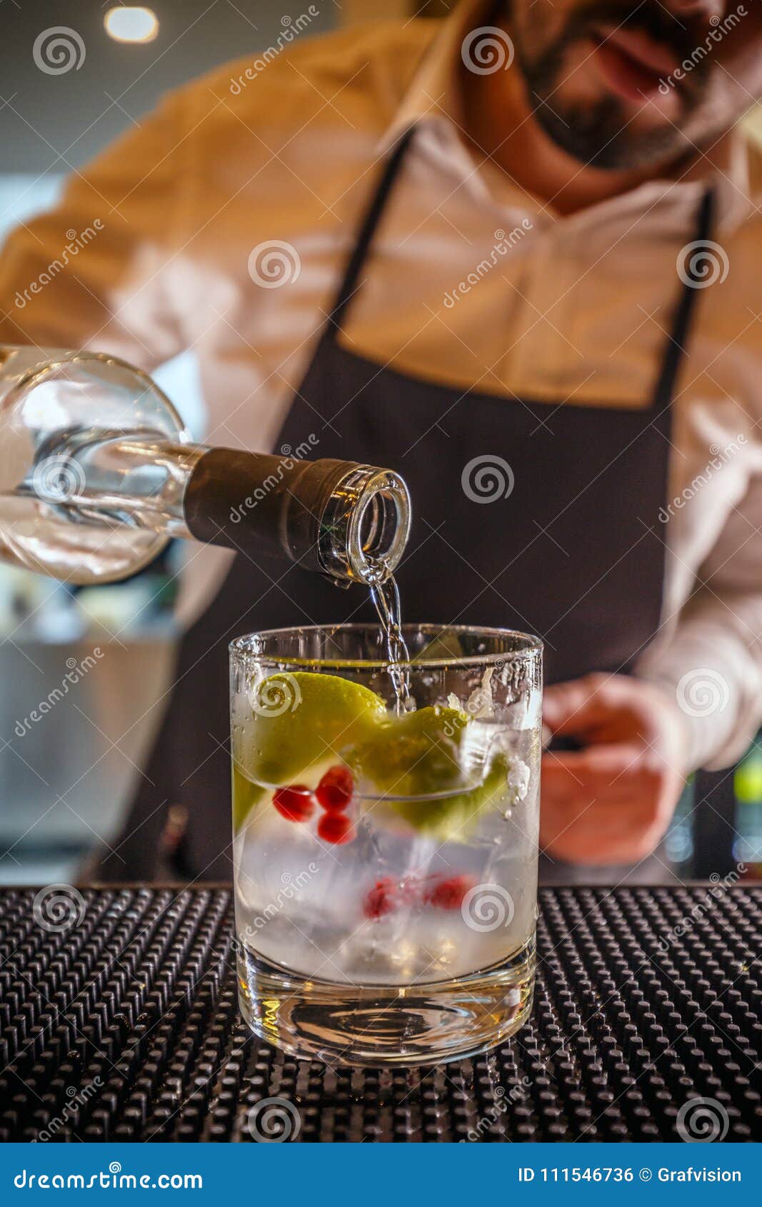 Bartender pouring vodka stock photo. Image of shot, barman - 111546736