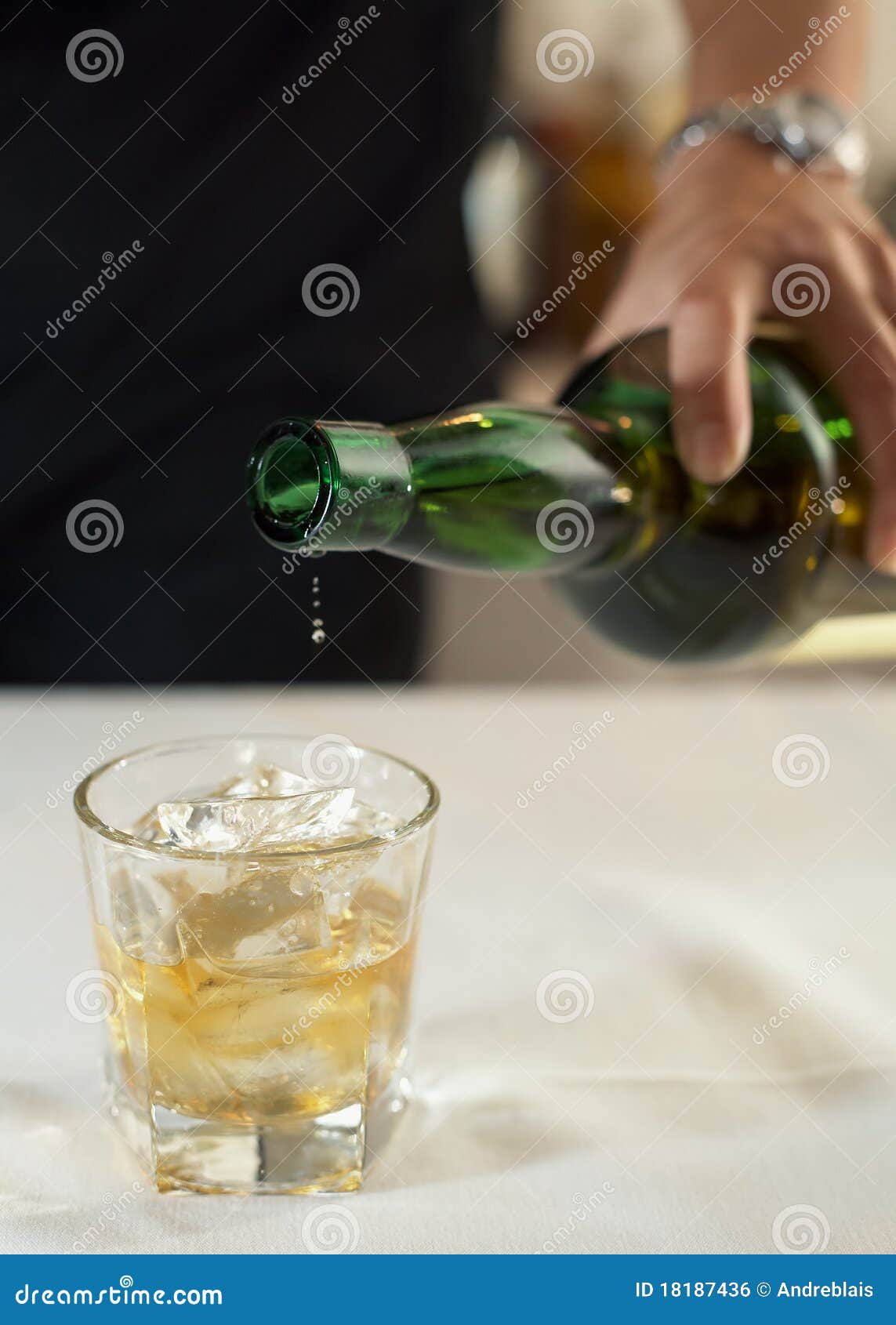 Bartender pouring whiskey stock photo. Image of intoxicated - 18187436