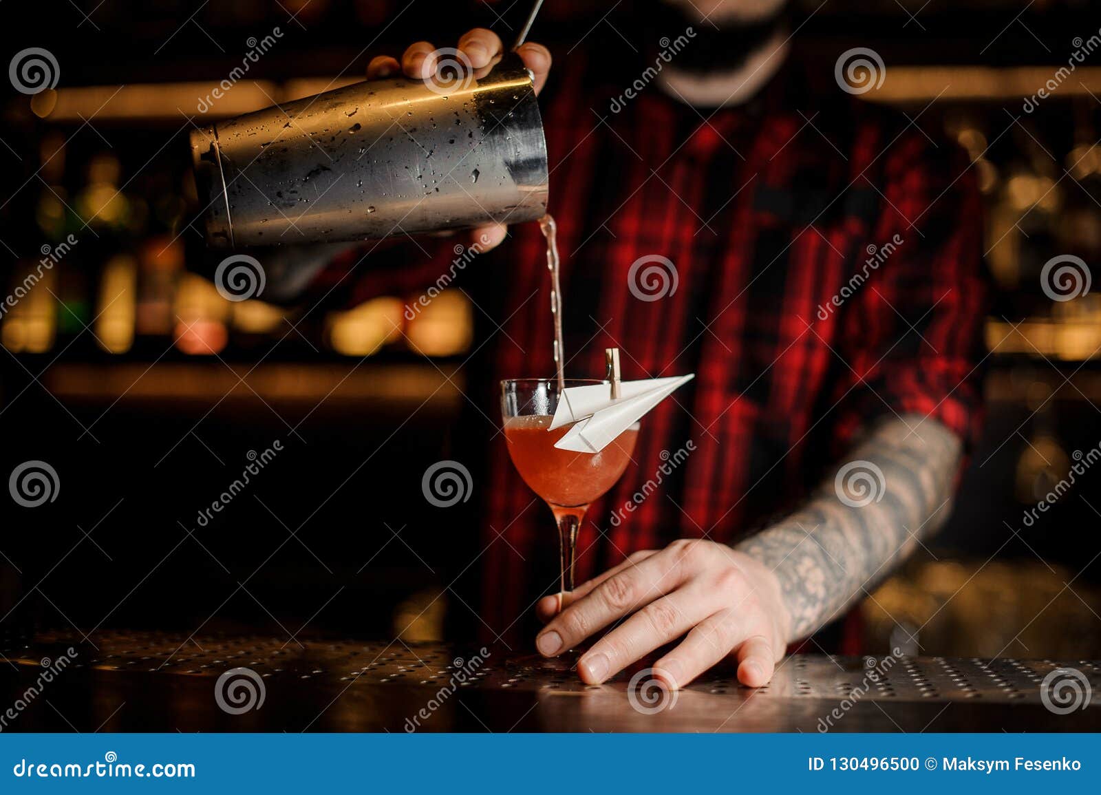 Bartender Pourring an Alcoholic Drink Making Cocktail in the Glass ...