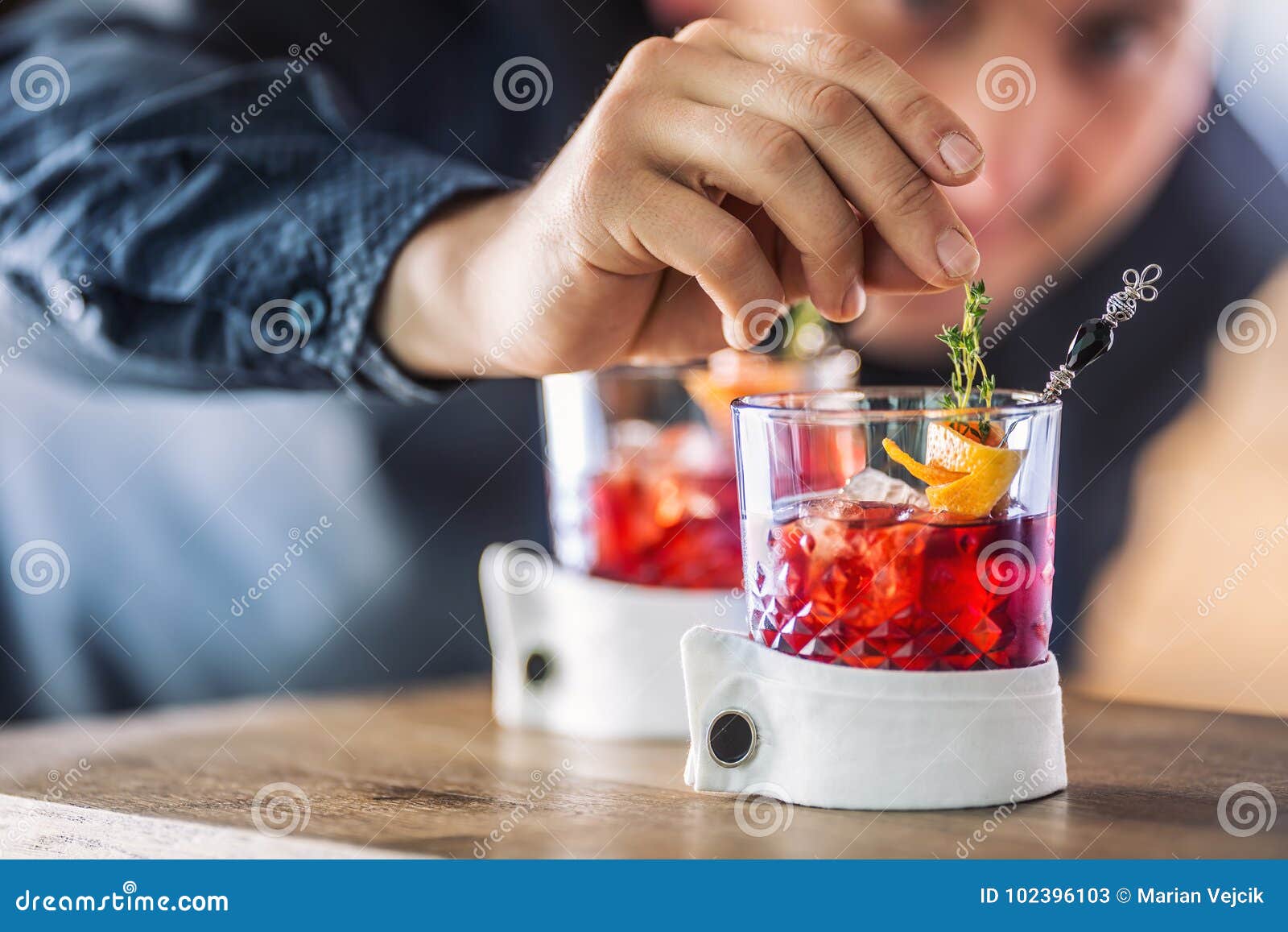 Bartender Precisely Preparing Cocktail Drink with Fruit and Herb ...