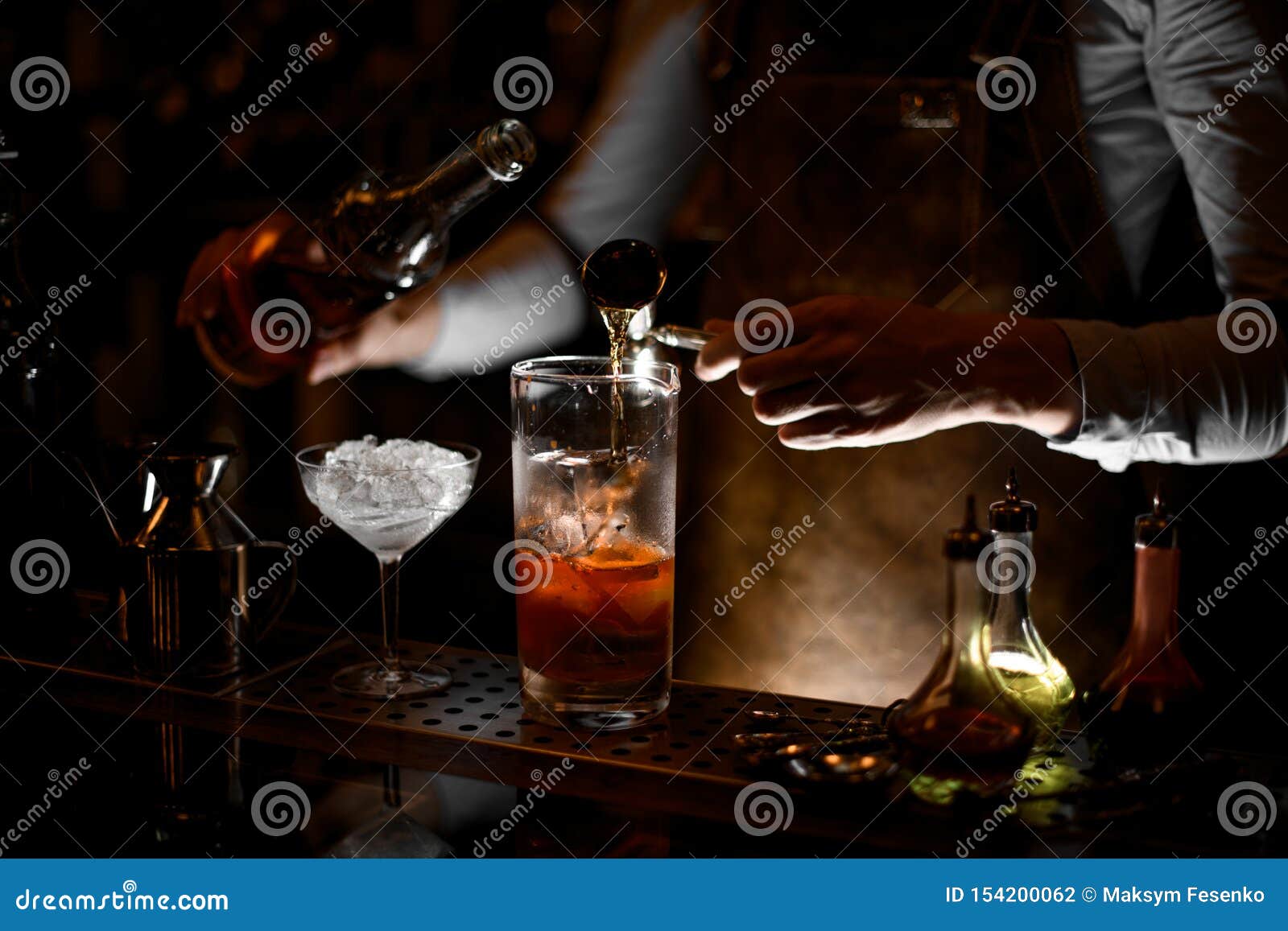 Bartender Preparing an Alcohol Cocktail Using Jigger Stock Photo ...