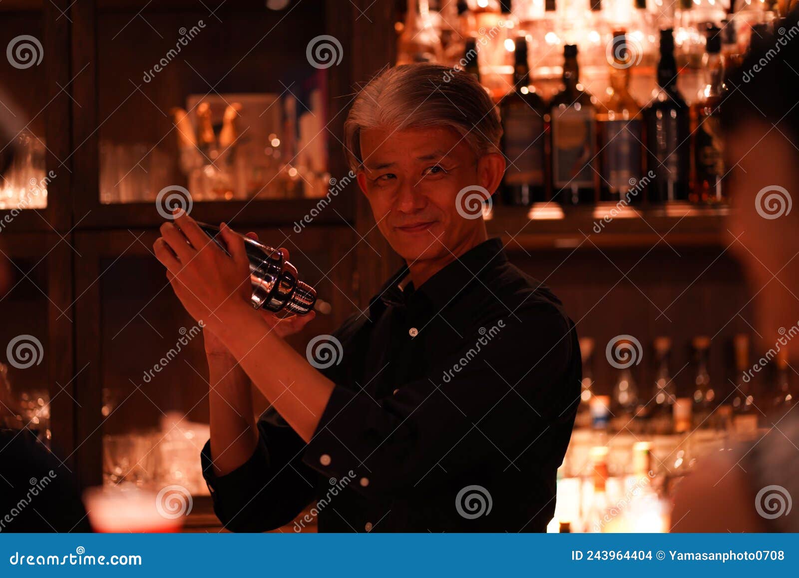 Bartender shaking a shaker stock photo. Image of moody - 243964404