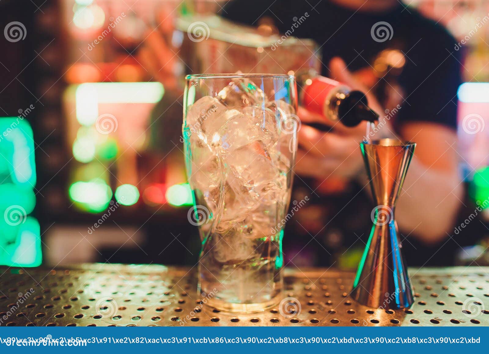 Bartender Squeezing Juice from Fresh Lime in a Glass Using Citrus Press ...