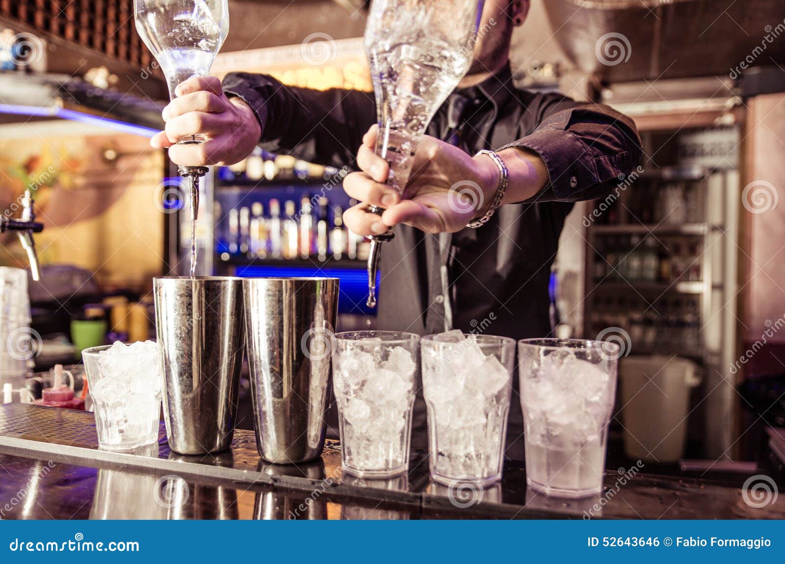 Bartender at work stock photo. Image of night, pour, bottle - 52643646