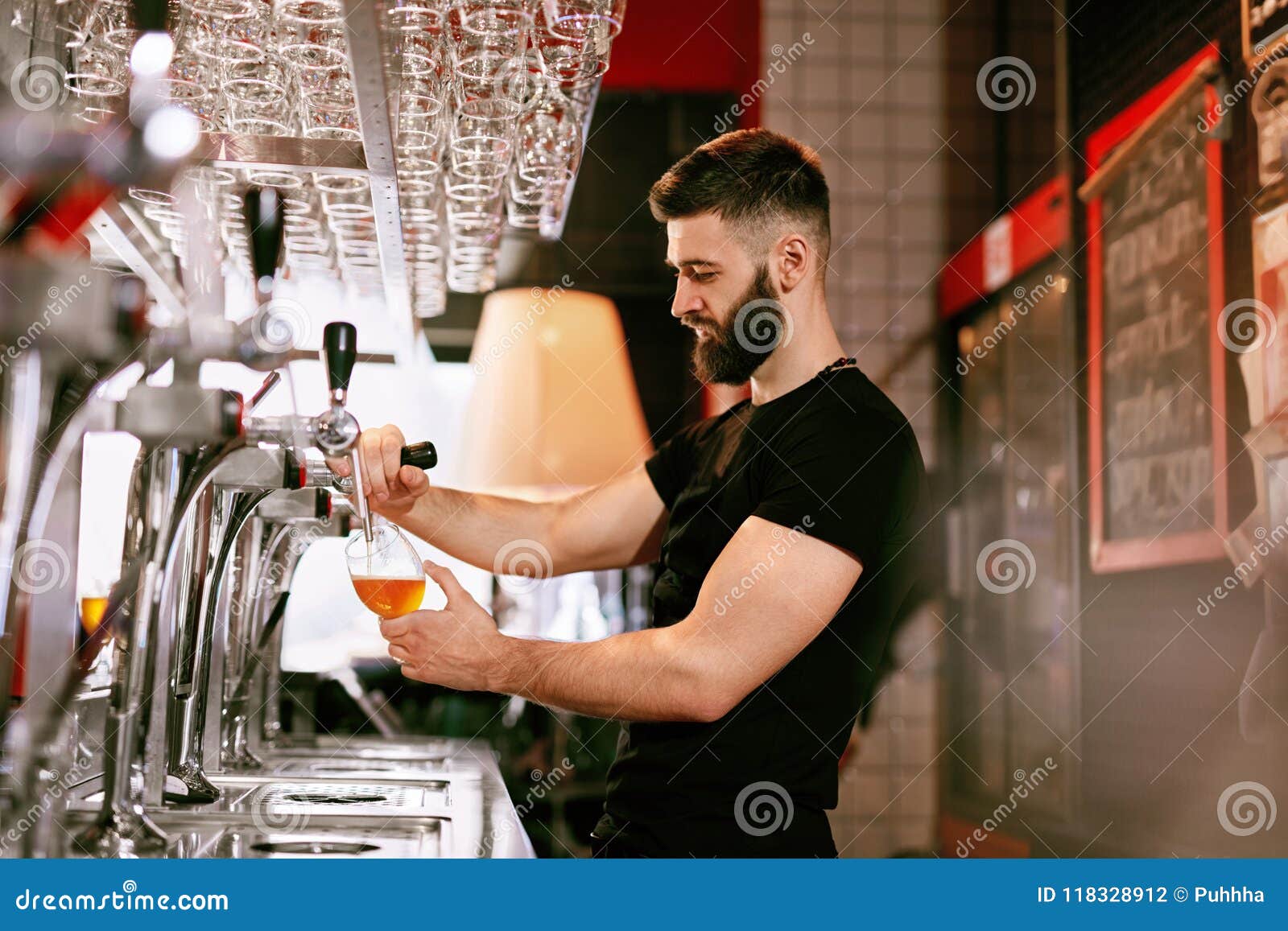 Bartender Working at Bar Pub Pouring Beer in Glass Stock Photo - Image ...