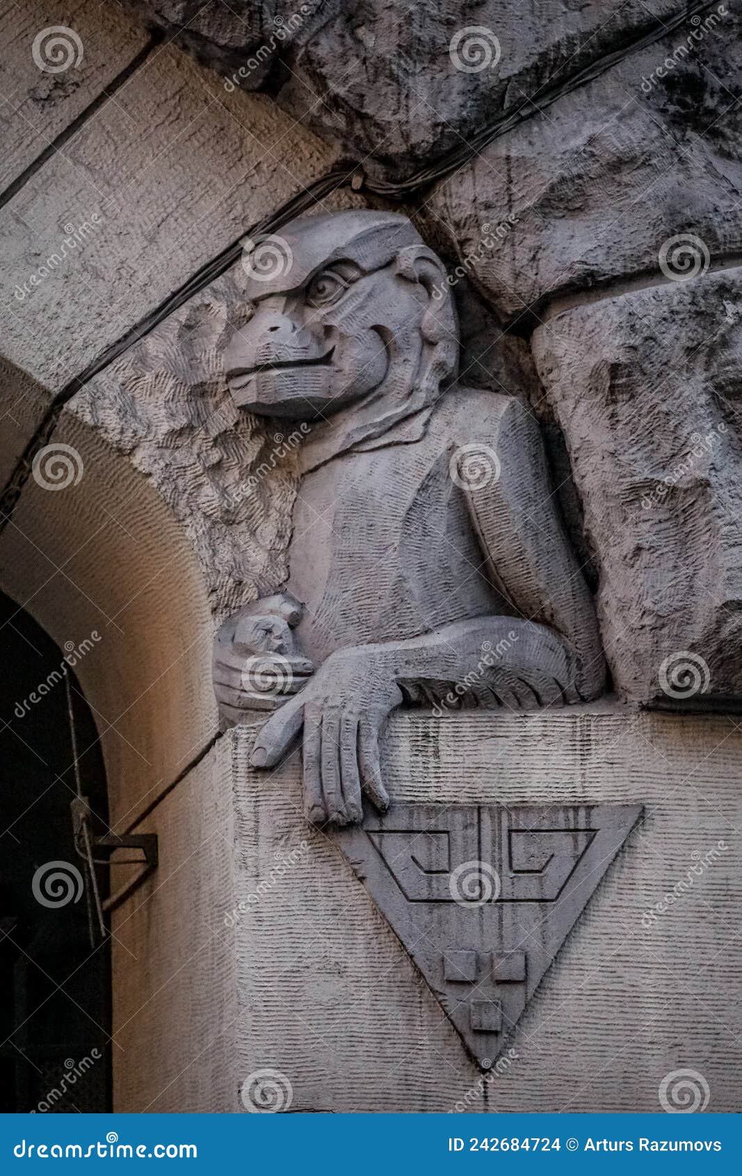 Statue of a Sitting Monkey - Stone Carving, Riga Stock Photo - Image of ...