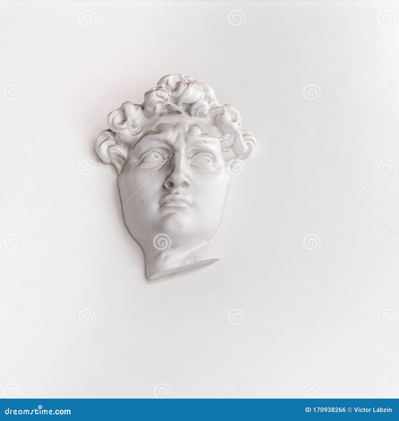 The Bas-relief of the Head of a Beautiful Young Man Stock Photo - Image ...