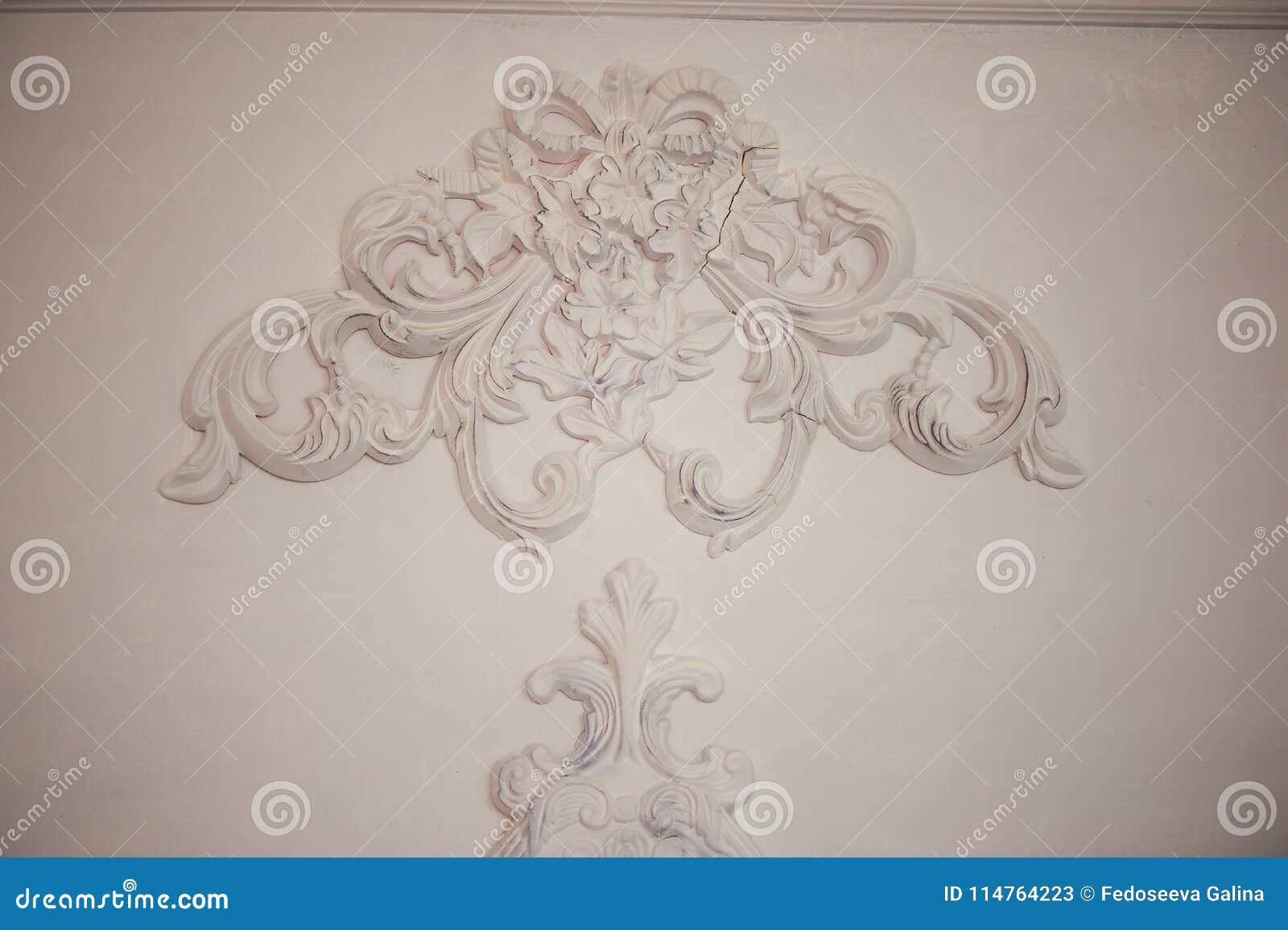 The Bas-relief on a White Wall.on the Wall a Ray of Light Falls. Old ...