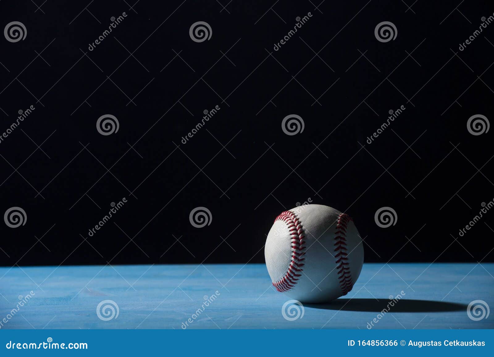 Baseball Ball on Blue Wooden Table Stock Photo - Image of dramatic ...