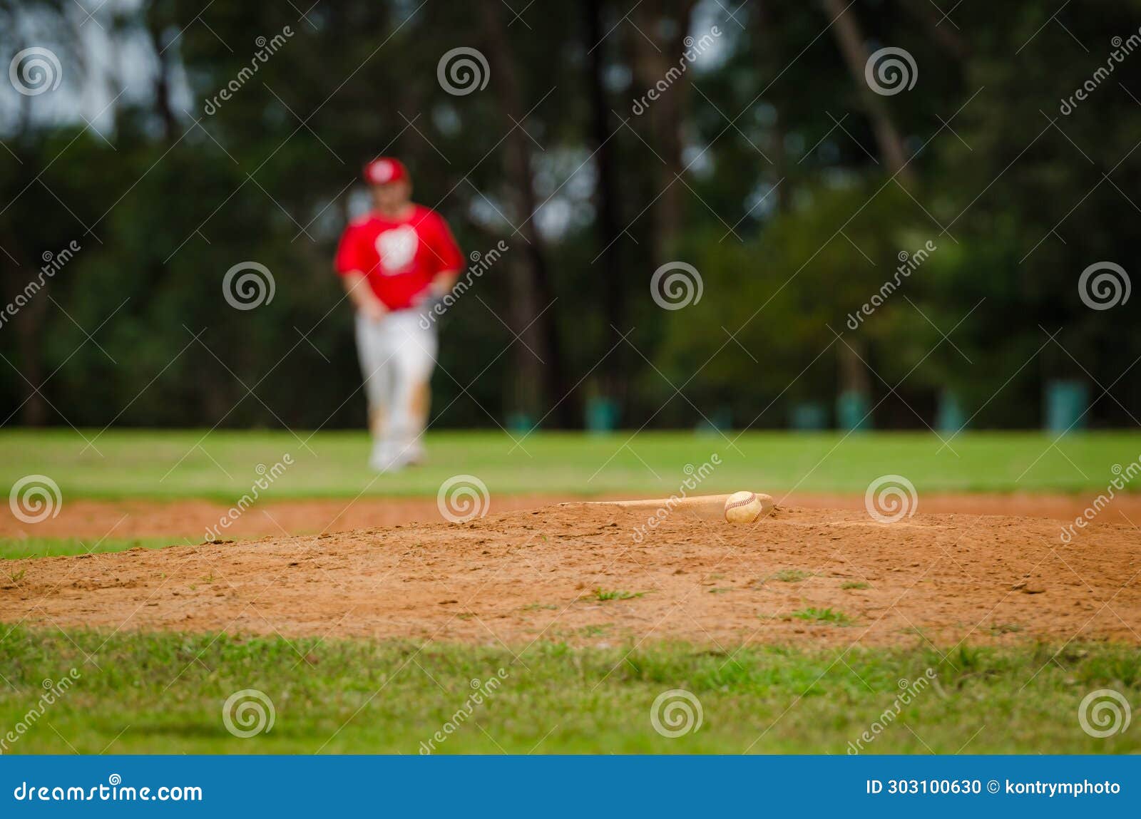 Baseball Ball Lying on the Diamond Next To the Pitching Rubber on the ...