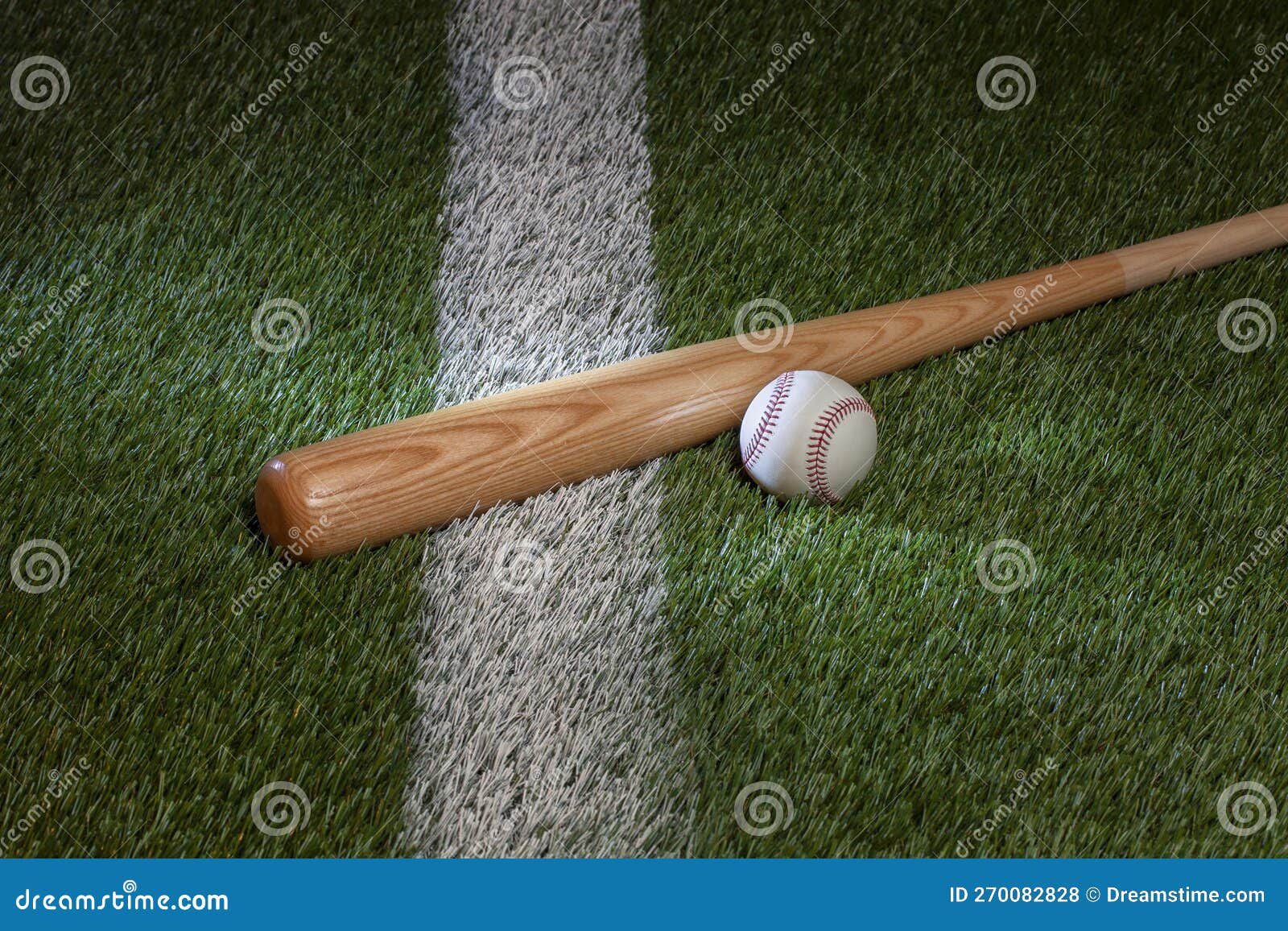 Baseball and Bat on Grass Field with White Stripe at Night Stock Photo ...