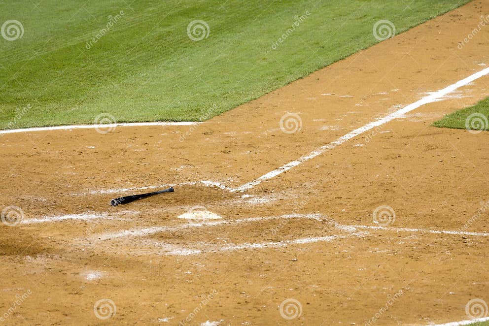 Baseball bat on ground stock photo. Image of ground, batter - 5302200