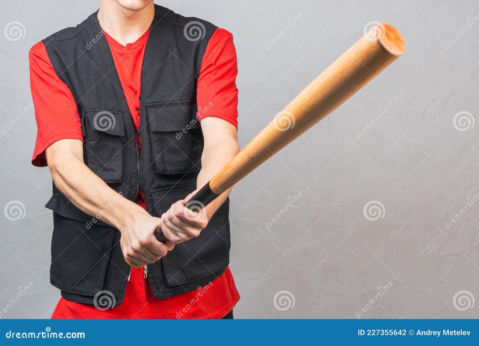 A Baseball Bat in the Hands of a Young White Man in a Black Vest Stock ...