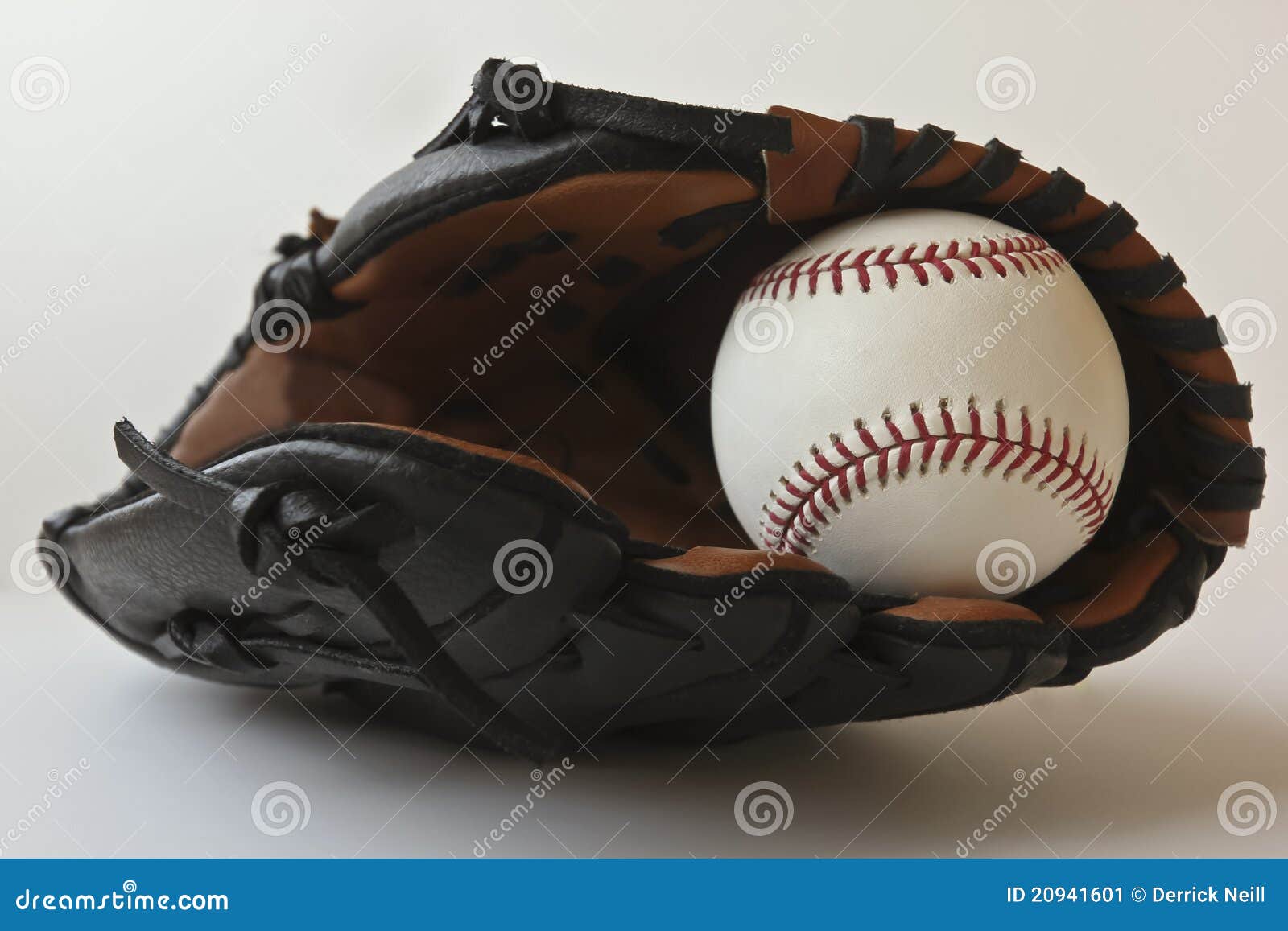 A Baseball in a Brown and Black Glove Stock Image - Image of pocket ...