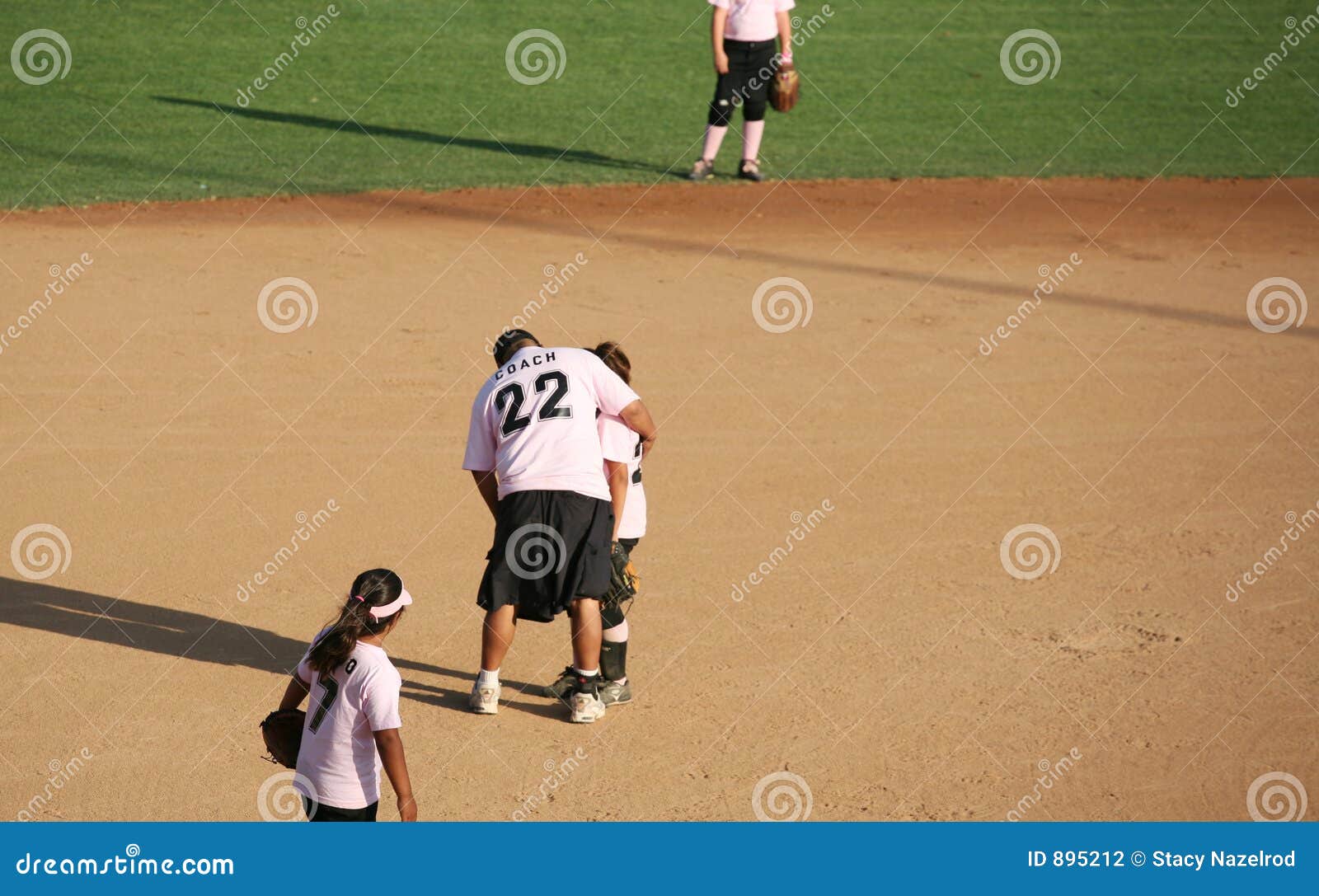 Baseball Coach Helping a Player Stock Photo - Image of footprints ...