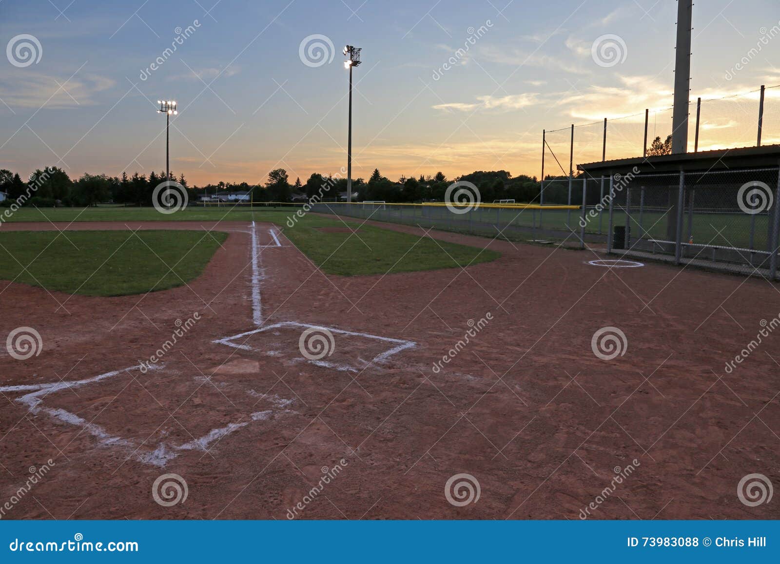 Baseball Diamond at Sunset stock photo. Image of lights - 73983088