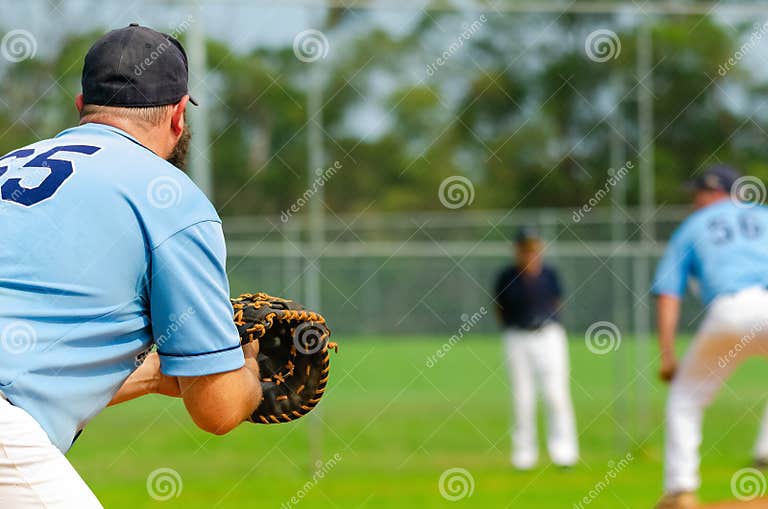 Baseball Game, First Baseman is Getting Ready To Catch a Ball from a ...
