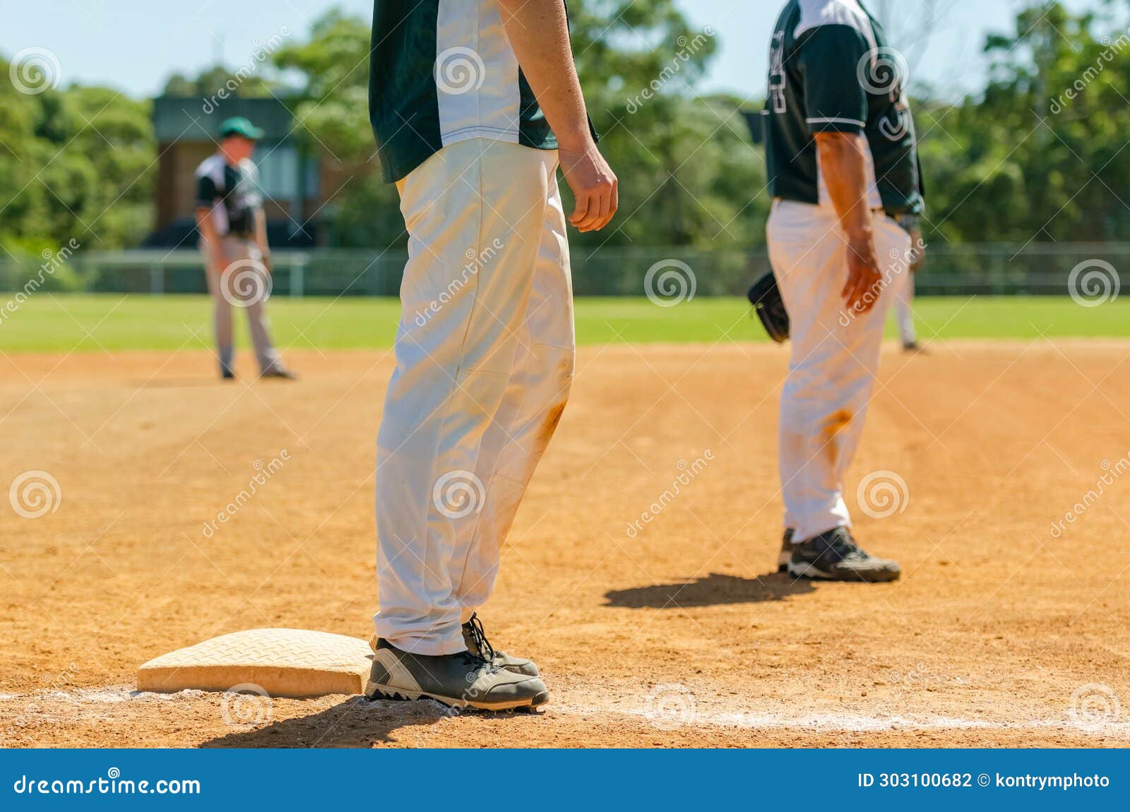 Baseball Game, Runner on the Third Base is Watching the Pitcher and ...
