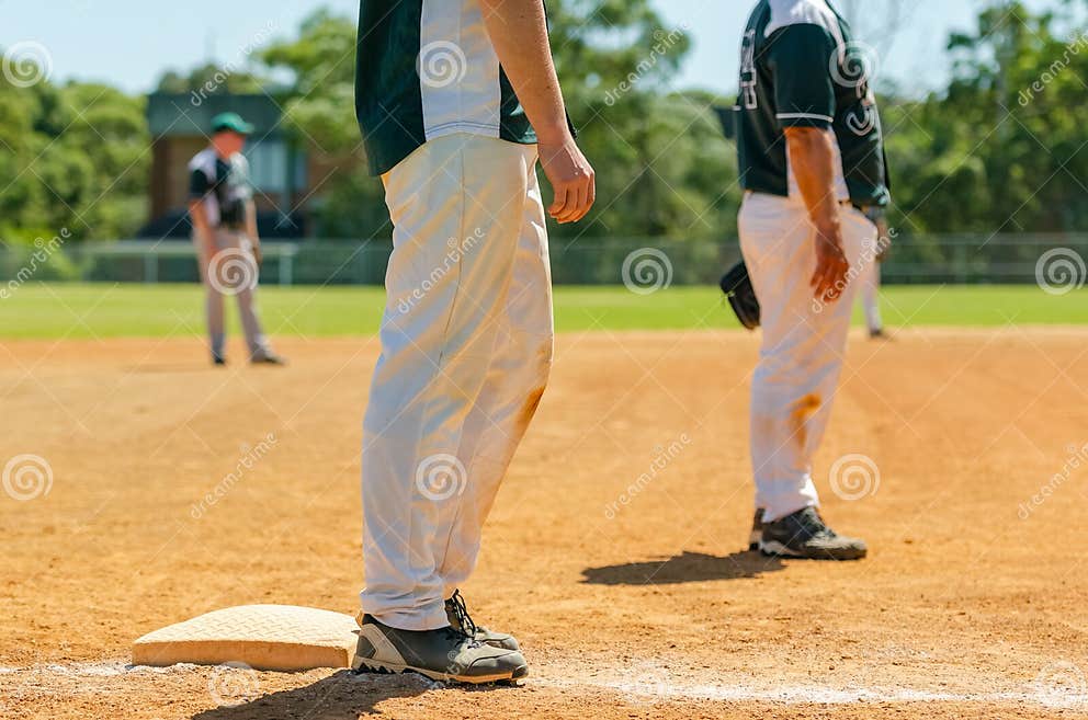 Baseball Game, Runner on the Third Base is Watching the Pitcher and ...