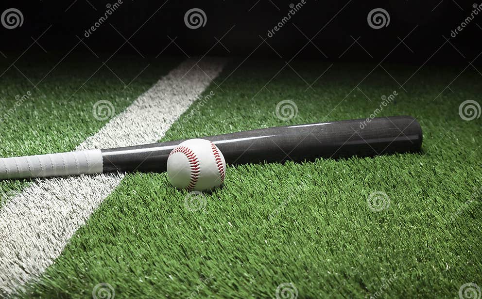 Baseball and Gray Bat on Field with Stripe and Dark Background Stock ...