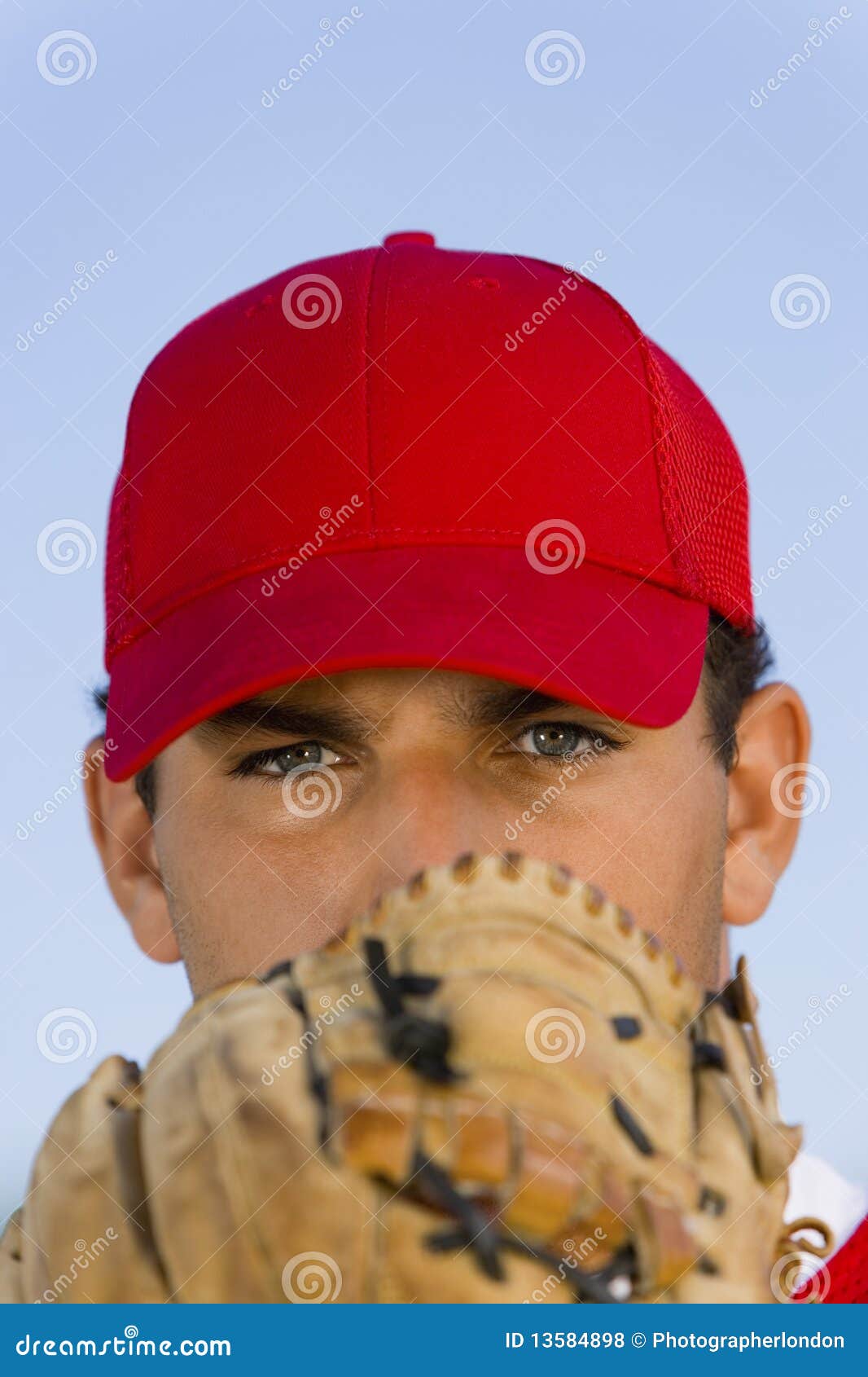 Baseball Pitcher Holding Glove in Front of Face Stock Photo - Image of ...