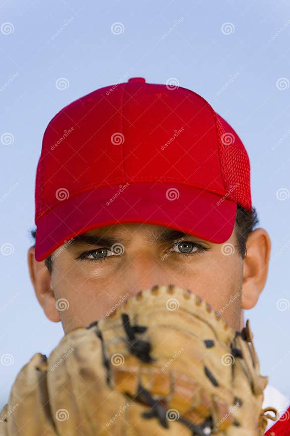 Baseball Pitcher Holding Glove in Front of Face Stock Photo - Image of ...
