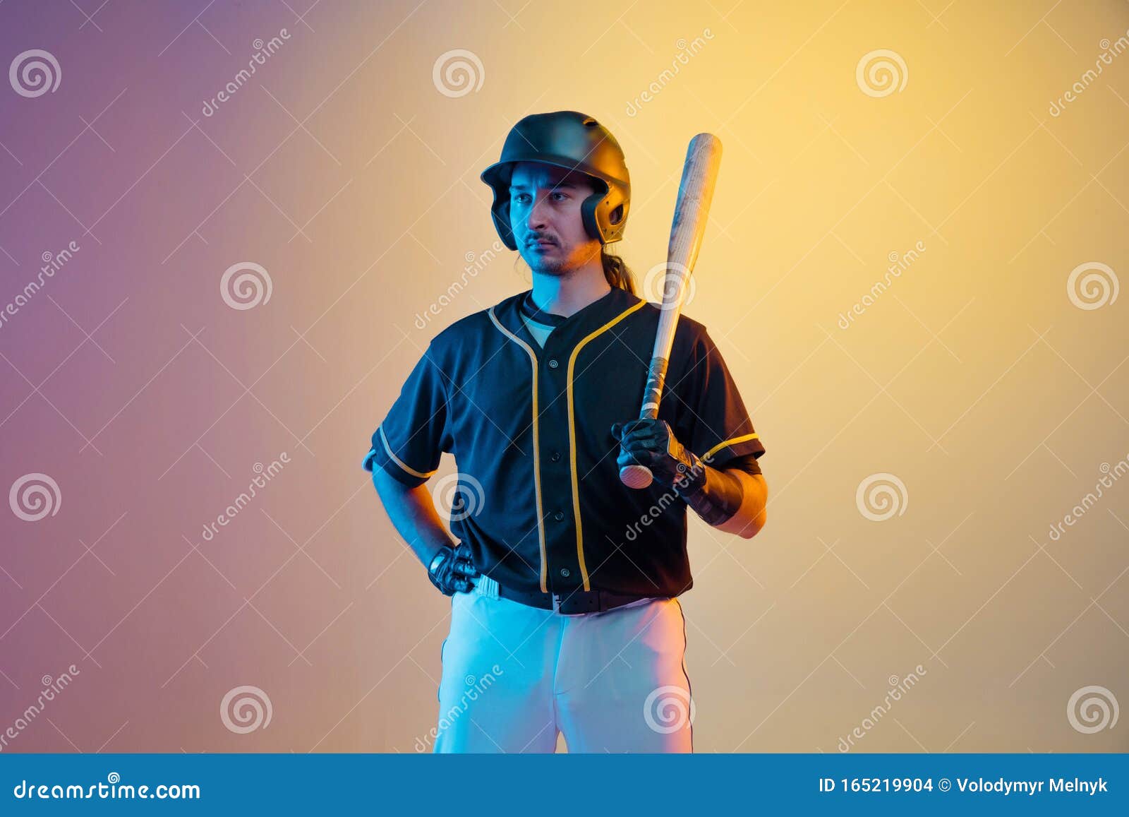 Baseball Player, Pitcher in a Black Uniform Practicing on Gradient ...