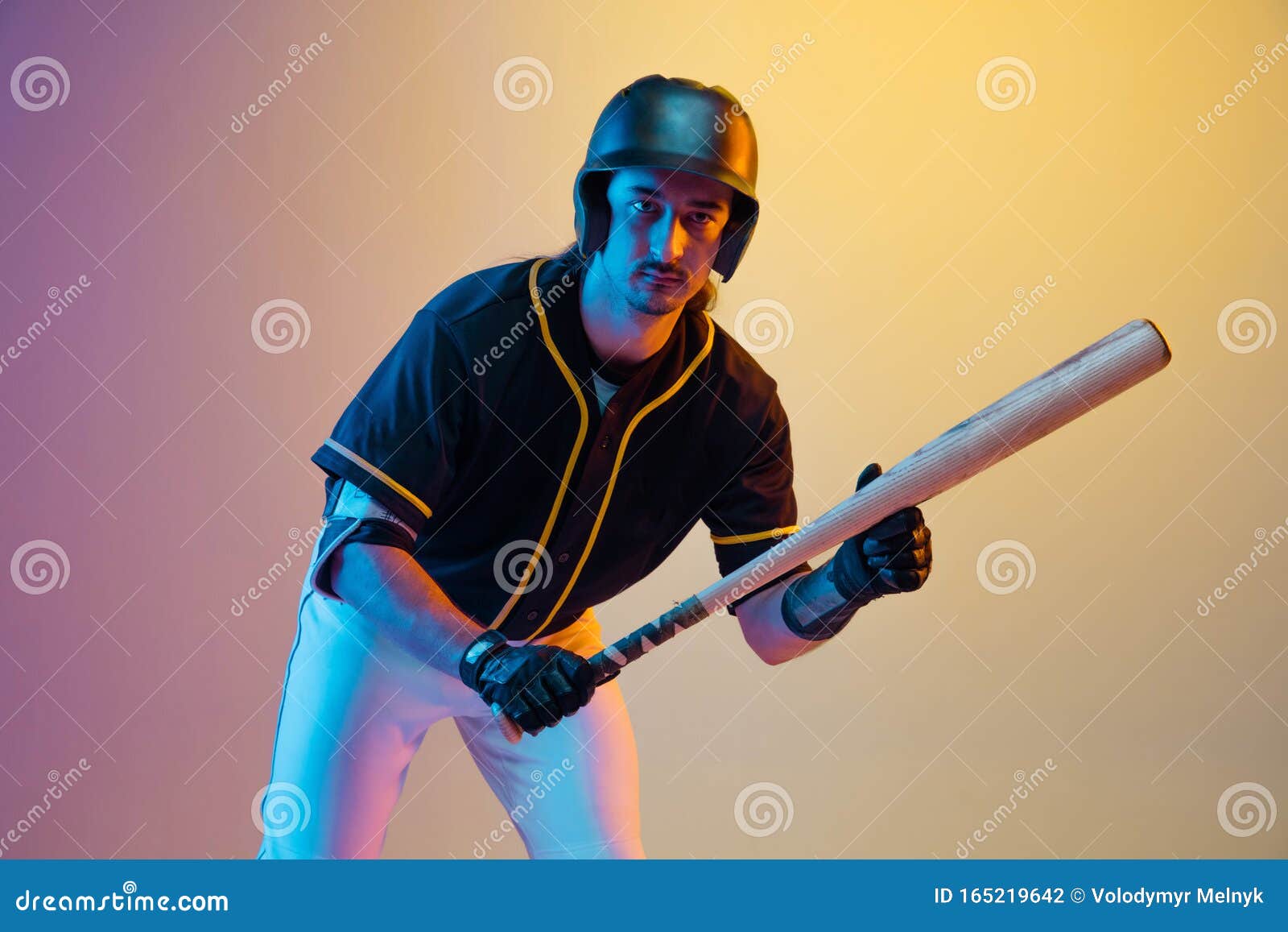 Baseball Player, Pitcher in a Black Uniform Practicing on Gradient ...