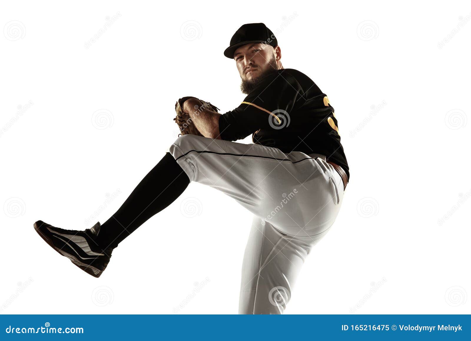 Baseball Player, Pitcher in a Black Uniform Practicing on a White ...