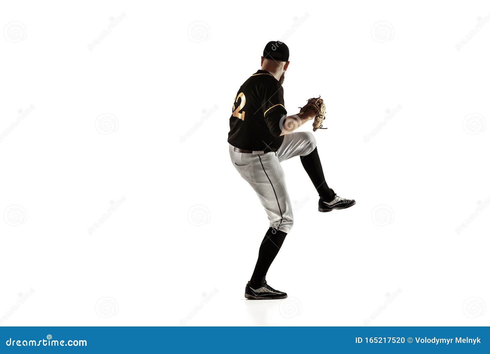 Baseball Player, Pitcher in a Black Uniform Practicing on a White ...