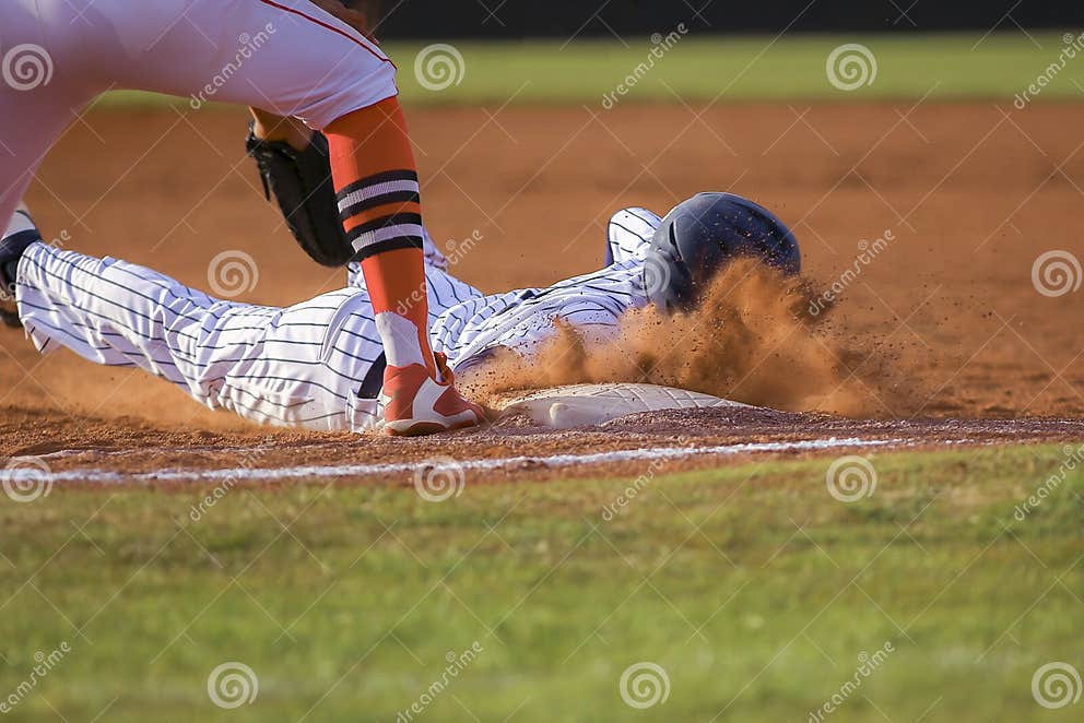 Baseball Player Sliding First Base Stock Photo - Image of ability, dust ...