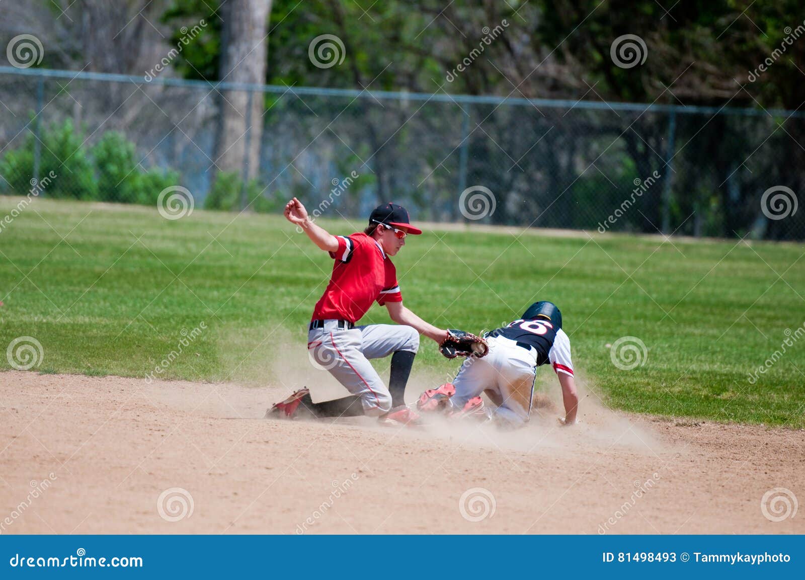 Teenage Baseball Shortstop Tagging Player Out at Second Base. Stock ...