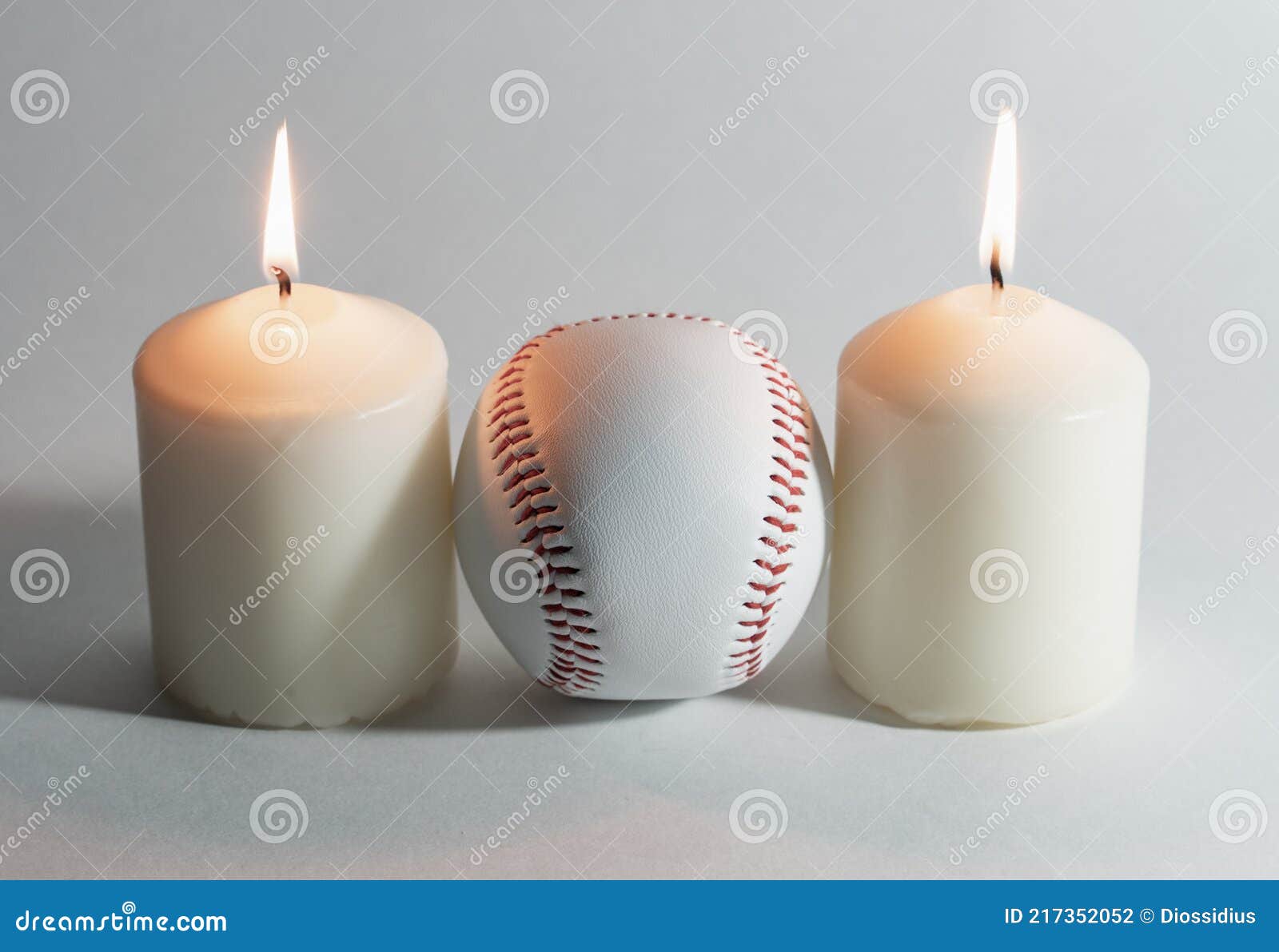 A Baseball between Two Candles Stock Photo - Image of candle, dishware ...