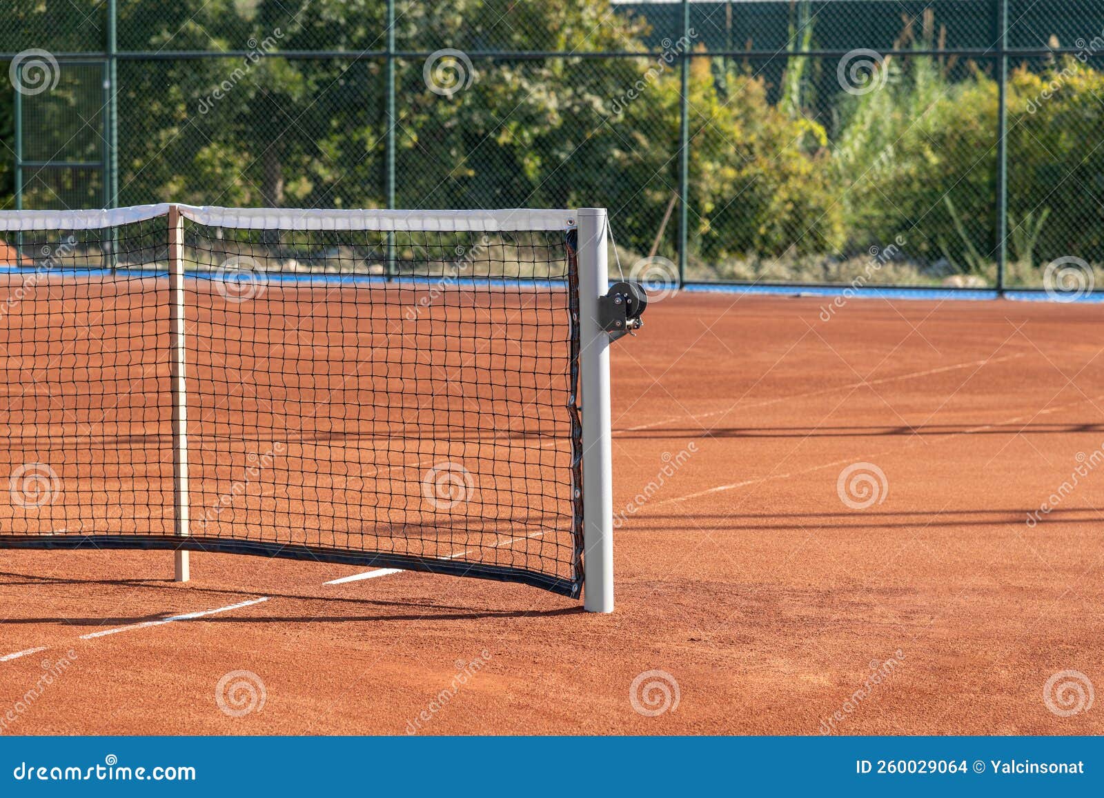 Baseline and Net of an Empty Clay Tennis Court on a Sunny Day Stock ...