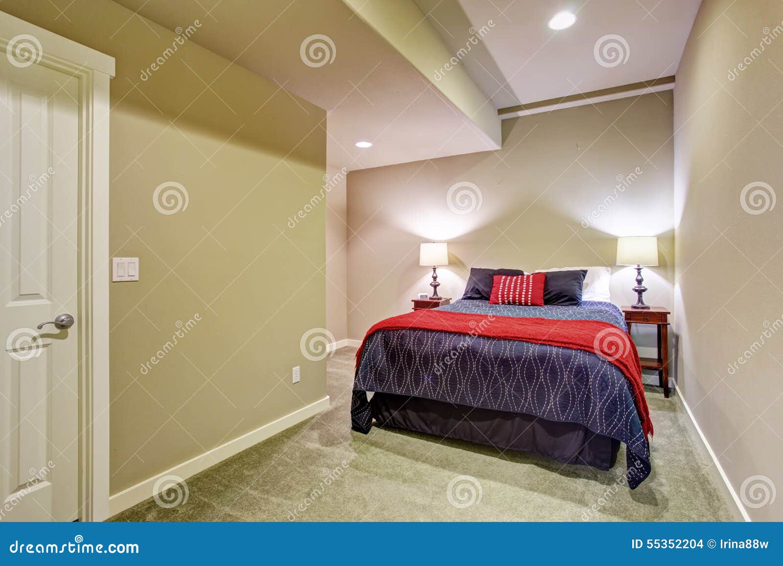 Basement Guest Bedroom with Blue and Red Bed Stock Photo - Image of ...