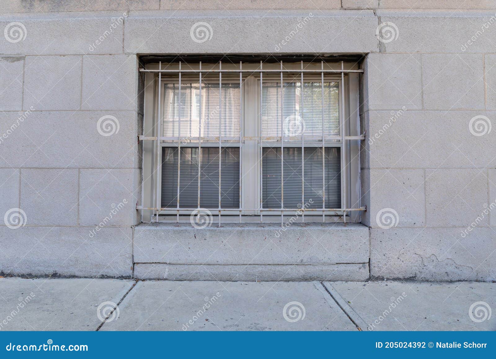 Basement Window with Metal Security Bars, Gray Stone Exterior, Sidewalk ...