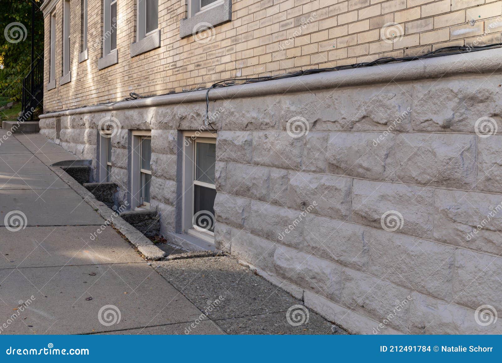 Basement Window Wells on a Building Made from Rusticated Stone and ...