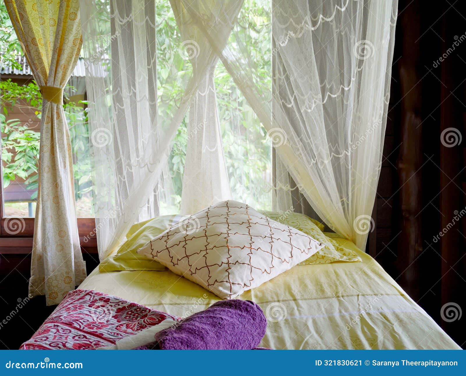 Basic Amenities on a Bed with Mosquito Net Stock Image - Image of ...