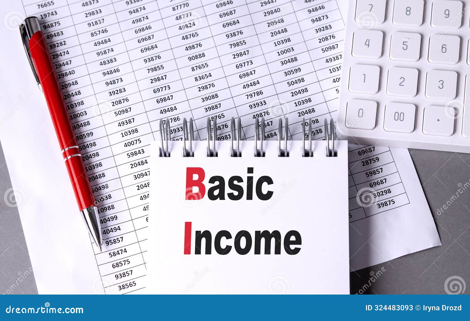 BASIC INCOME Text on Notebook with Chart , Pen and Calculator Stock ...