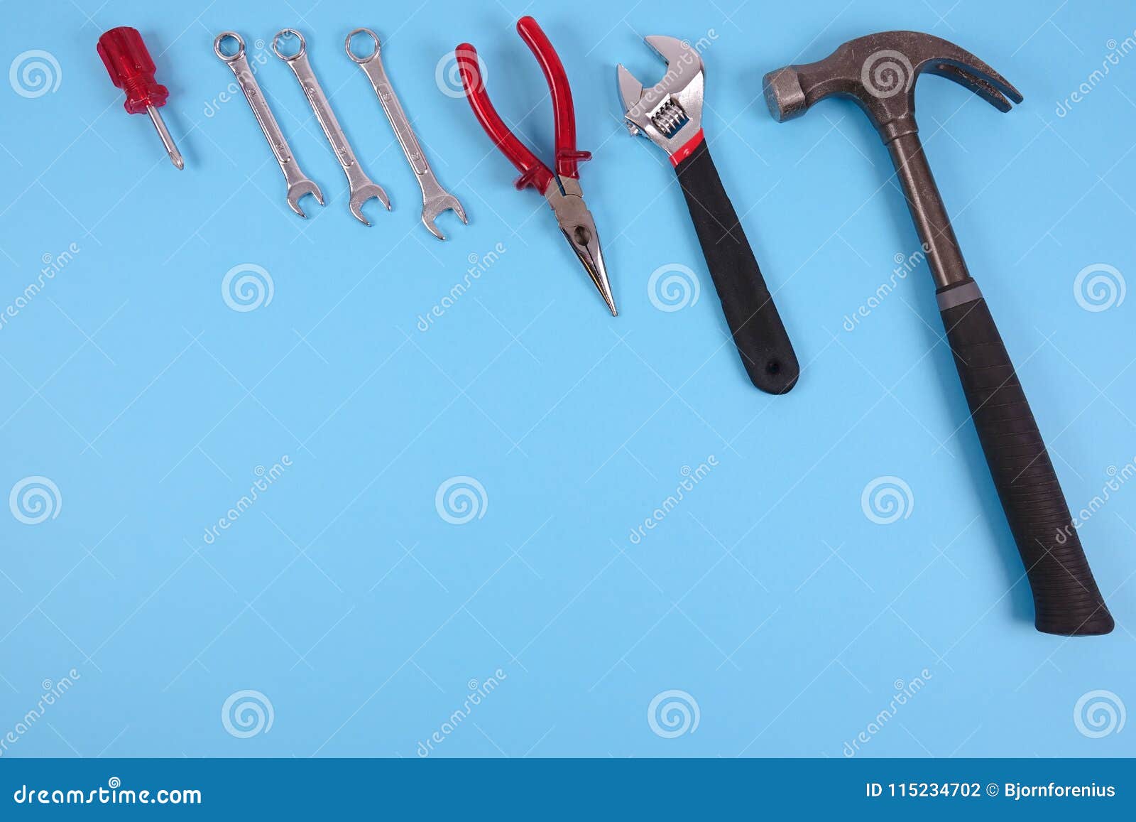 Basic Tools Like Hammer and Wrenches on a Blue Background Stock Photo ...