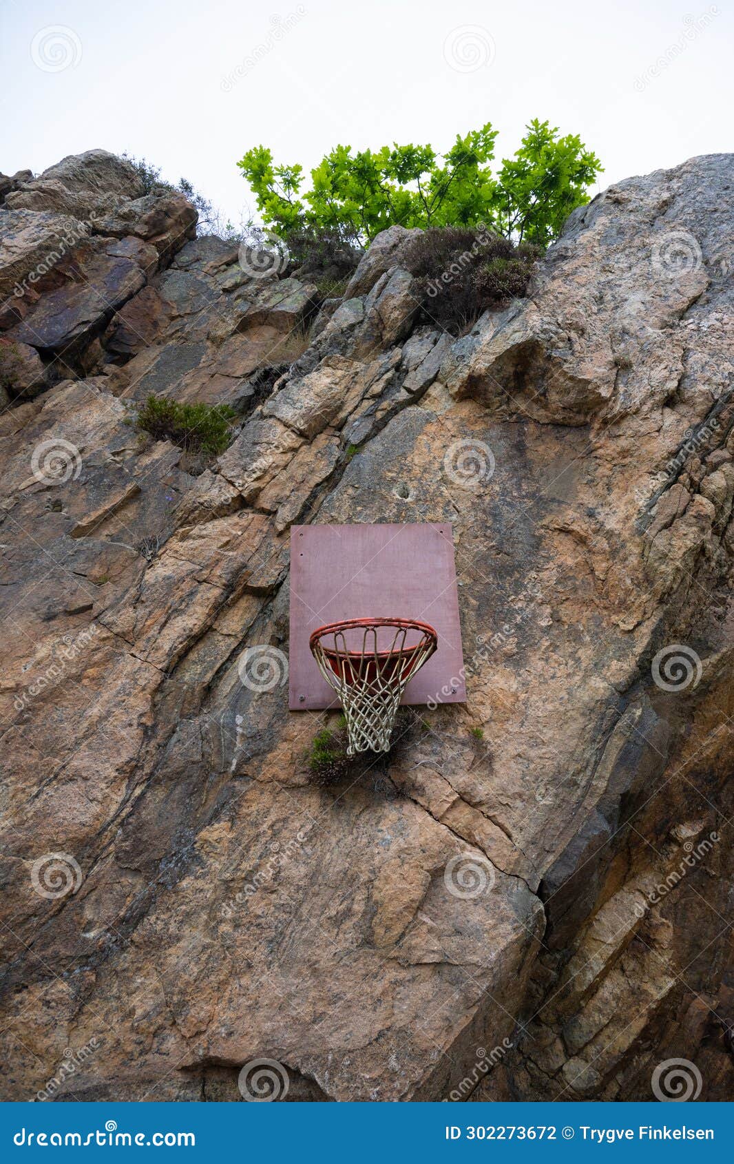 Basket Ball Basket Hanging from a Stone Cliff Face.. Stock Photo ...